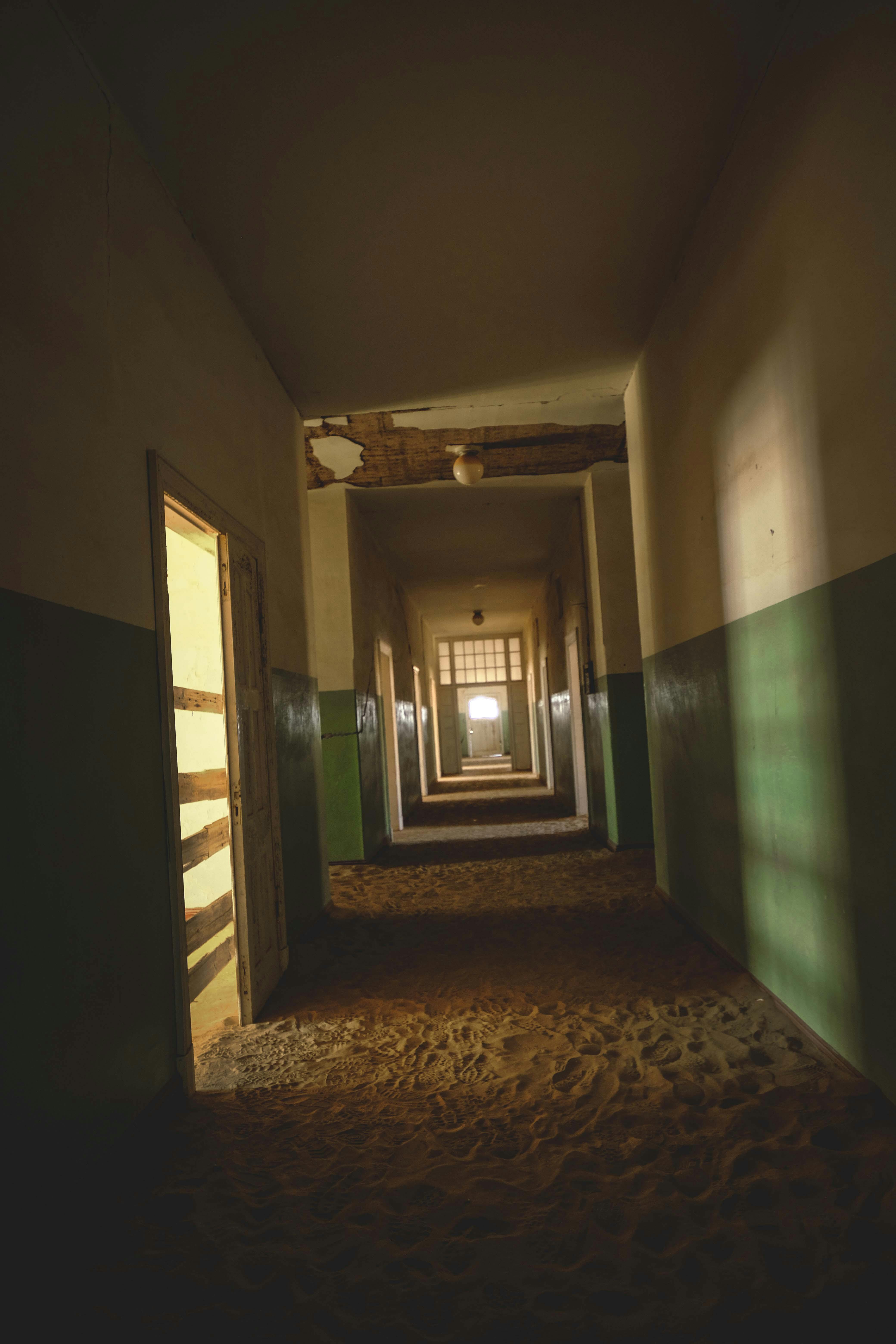 Abandoned Sand-Filled Hallway in Kolmanskop · Free Stock Photo
