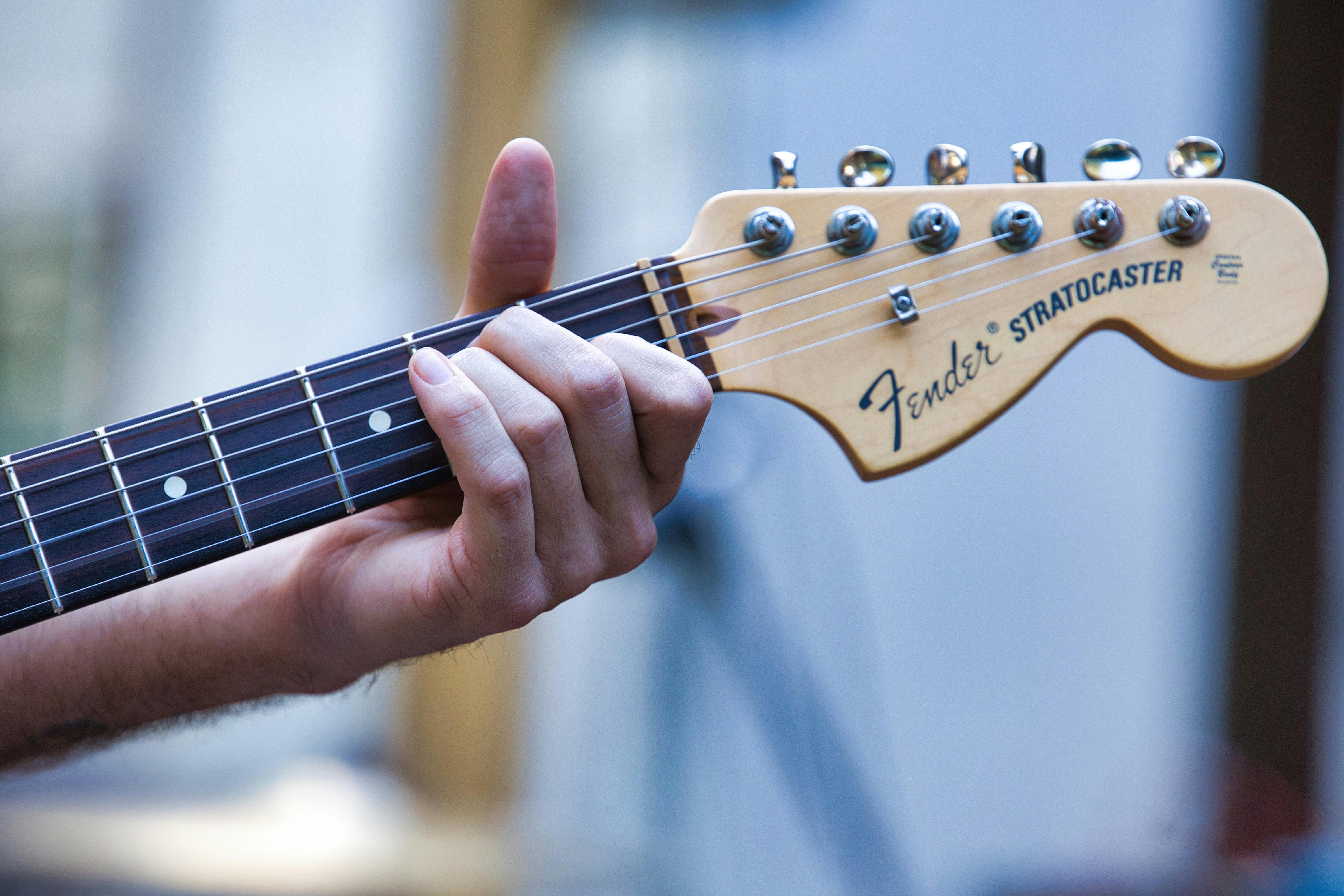Close-up of a Guitarist Playing Stratocaster · Free Stock Photo