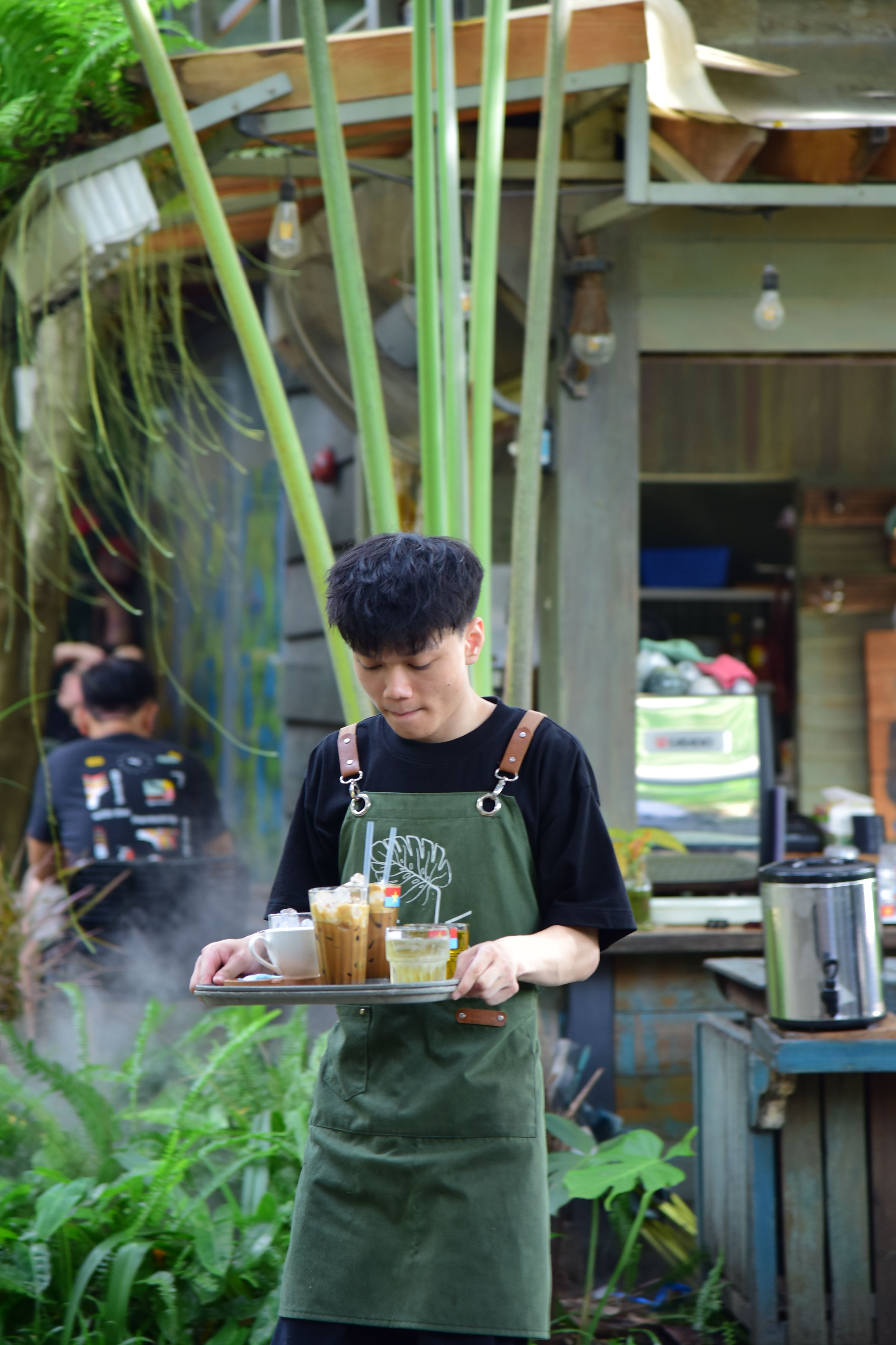 Barista Serving Freshly Brewed Coffee Outdoors · Free Stock Photo