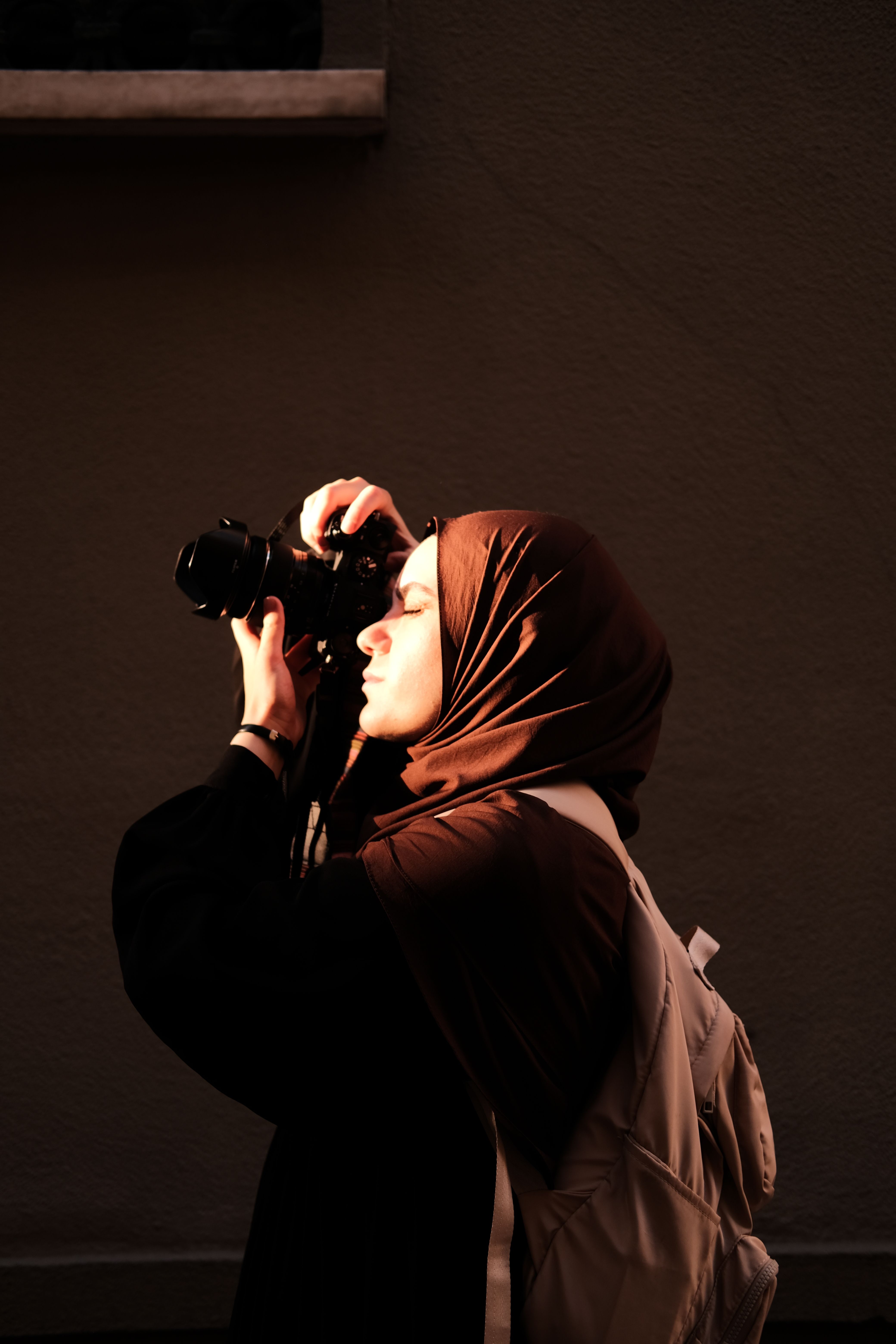 Young Photographer Capturing a Creative Moment at Dusk · Free Stock Photo