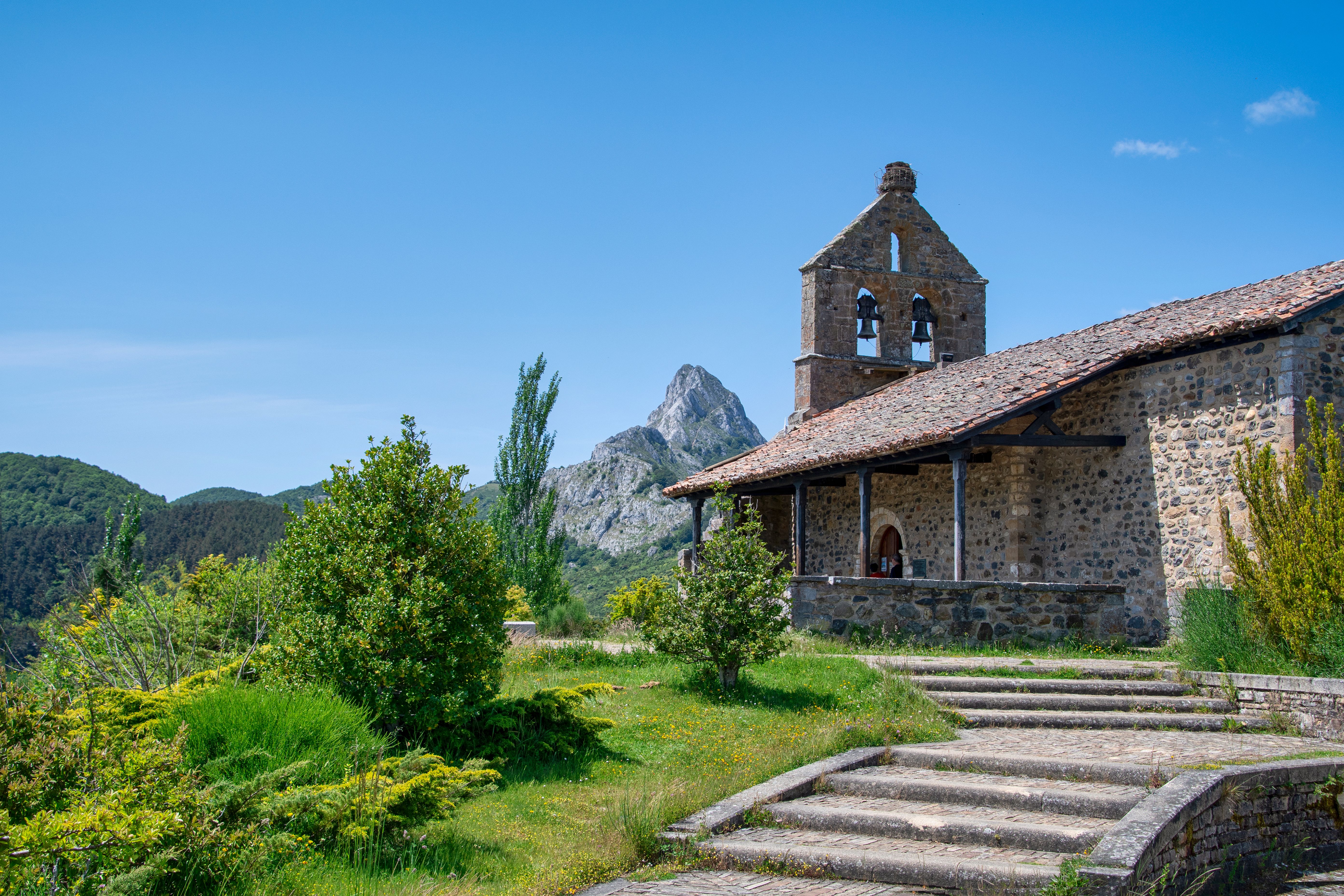 Rustic Stone Church in Scenic Mountain Landscape · Free Stock Photo