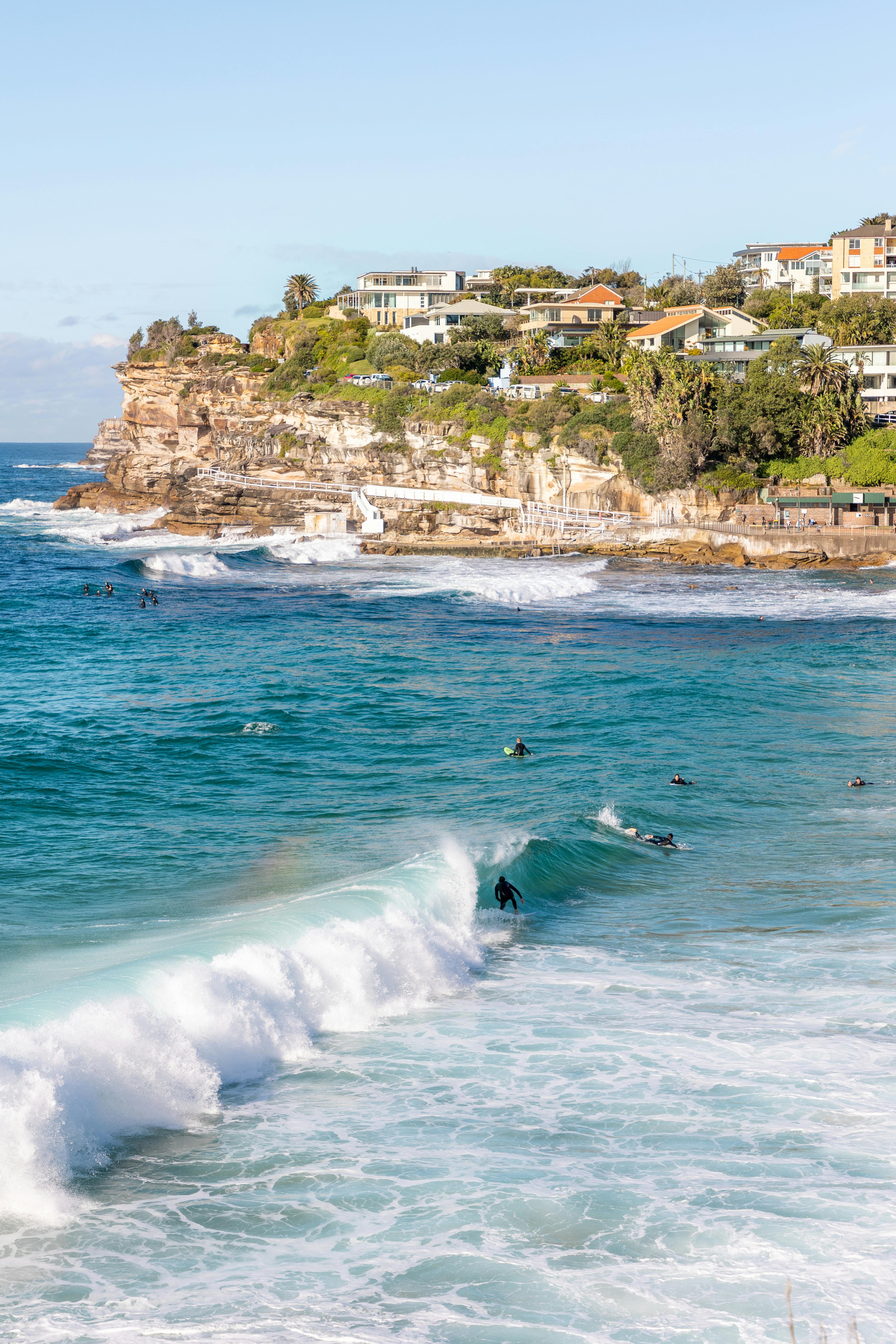 Surfers Riding Waves by Bondi Cliffside · Free Stock Photo