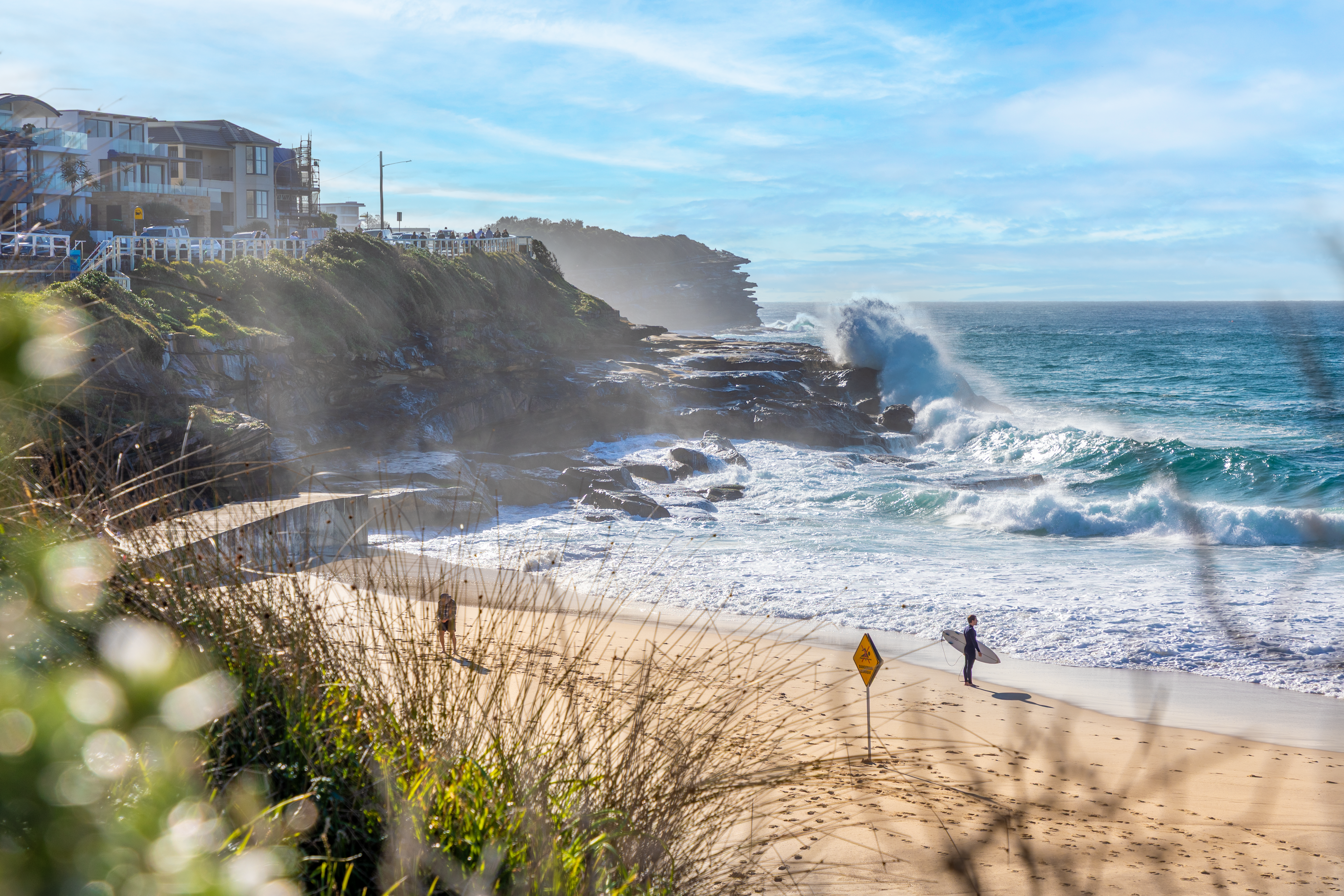 Surfer Approaching the Scenic Beachfront Waves · Free Stock Photo
