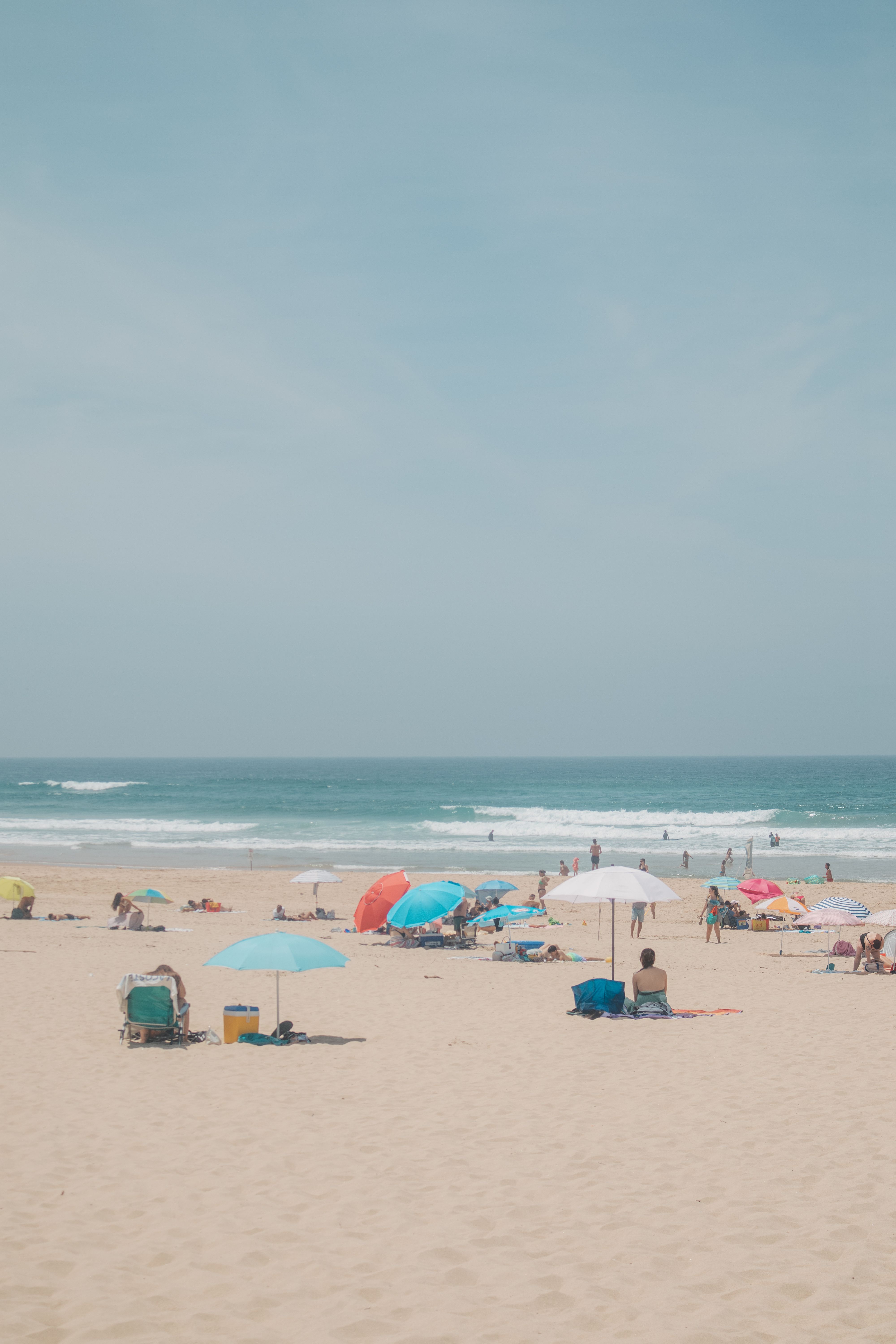 Sunny Beach Day with Colorful Umbrellas · Free Stock Photo