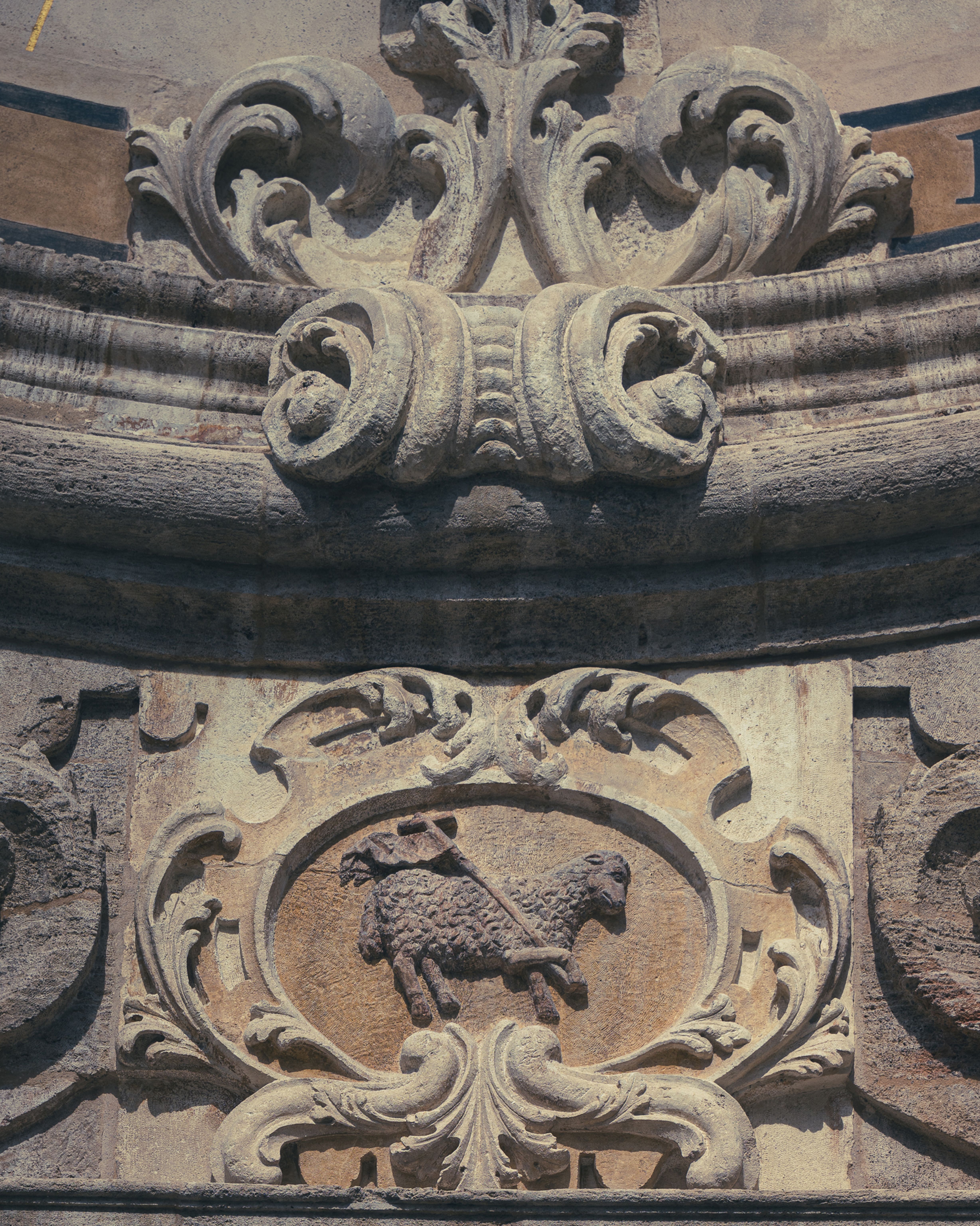 Ornate Architectural Stone Carving with Lamb · Free Stock Photo
