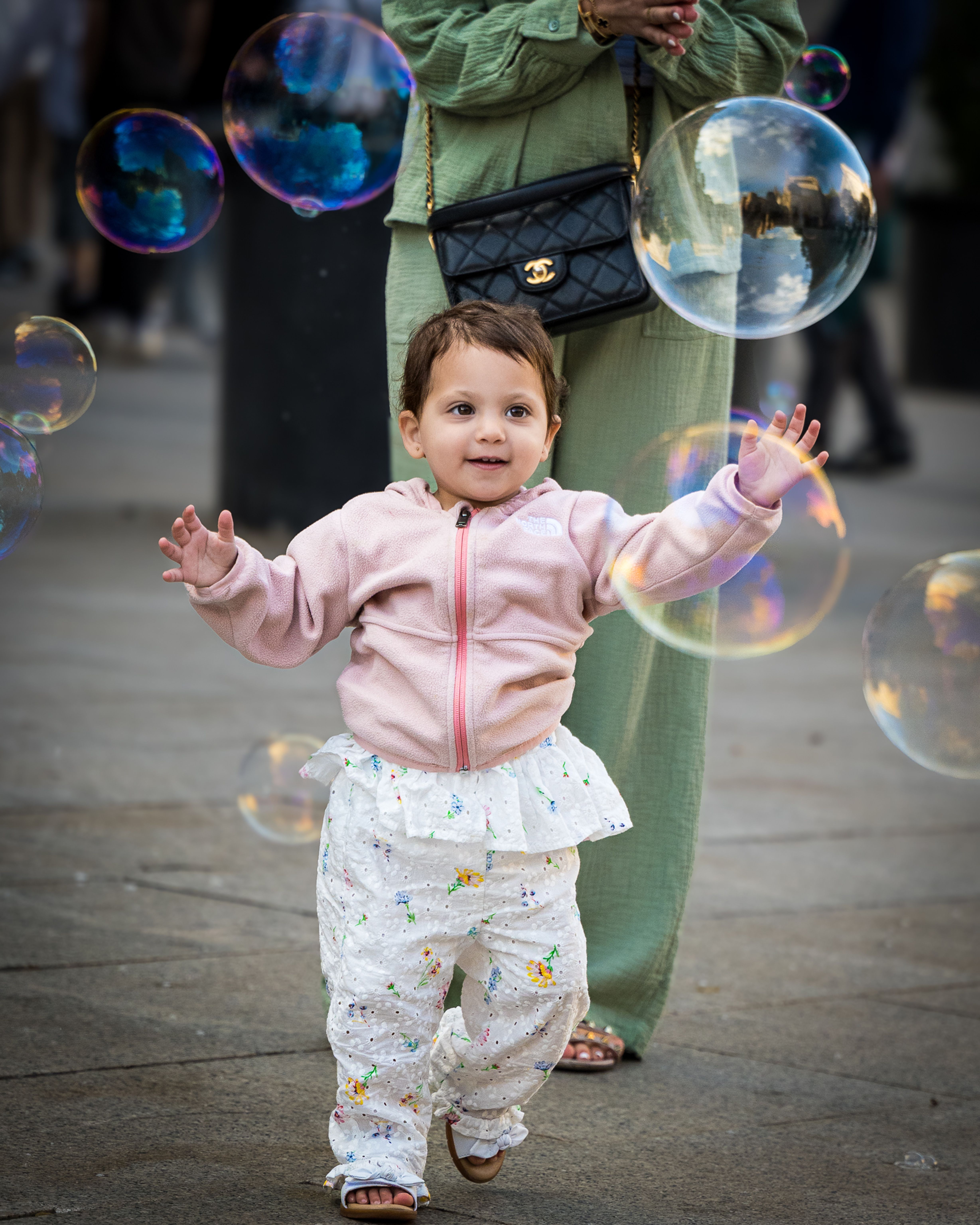 Joyful Child Playing with Bubbles Outdoors · Free Stock Photo