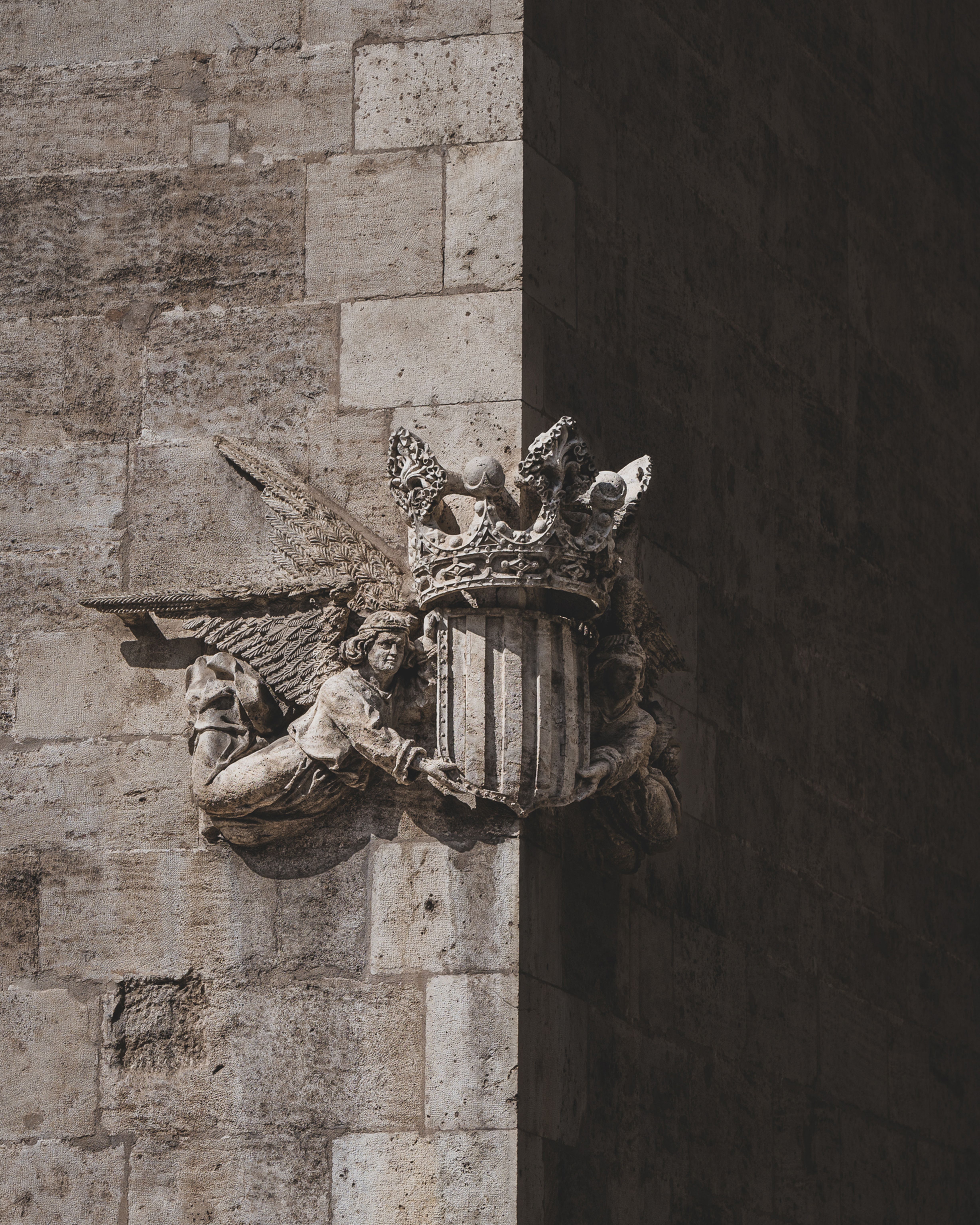 Historic Stone Angel Sculpture on Building Exterior · Free Stock Photo