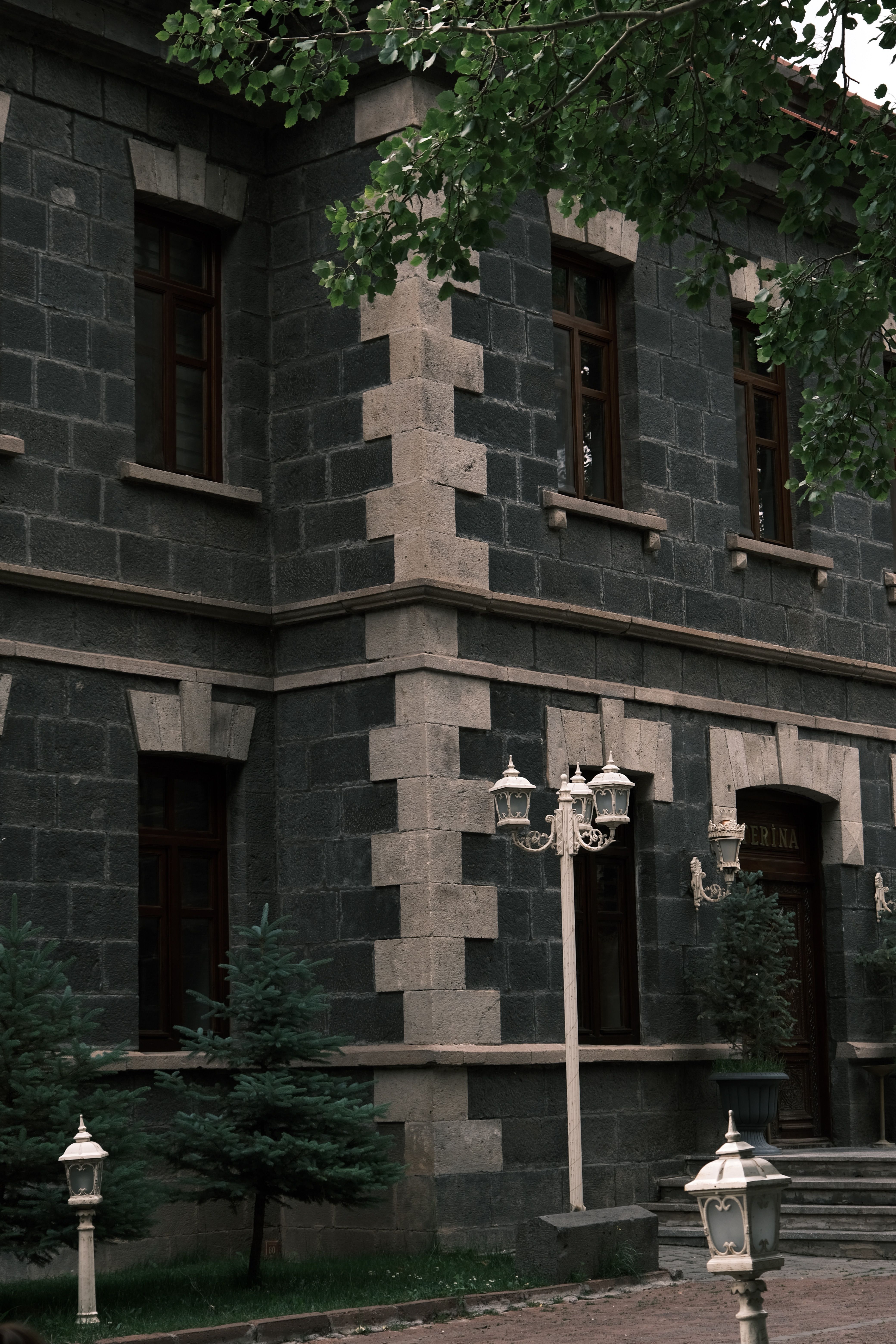 Classic Stone Building Facade with Lanterns · Free Stock Photo