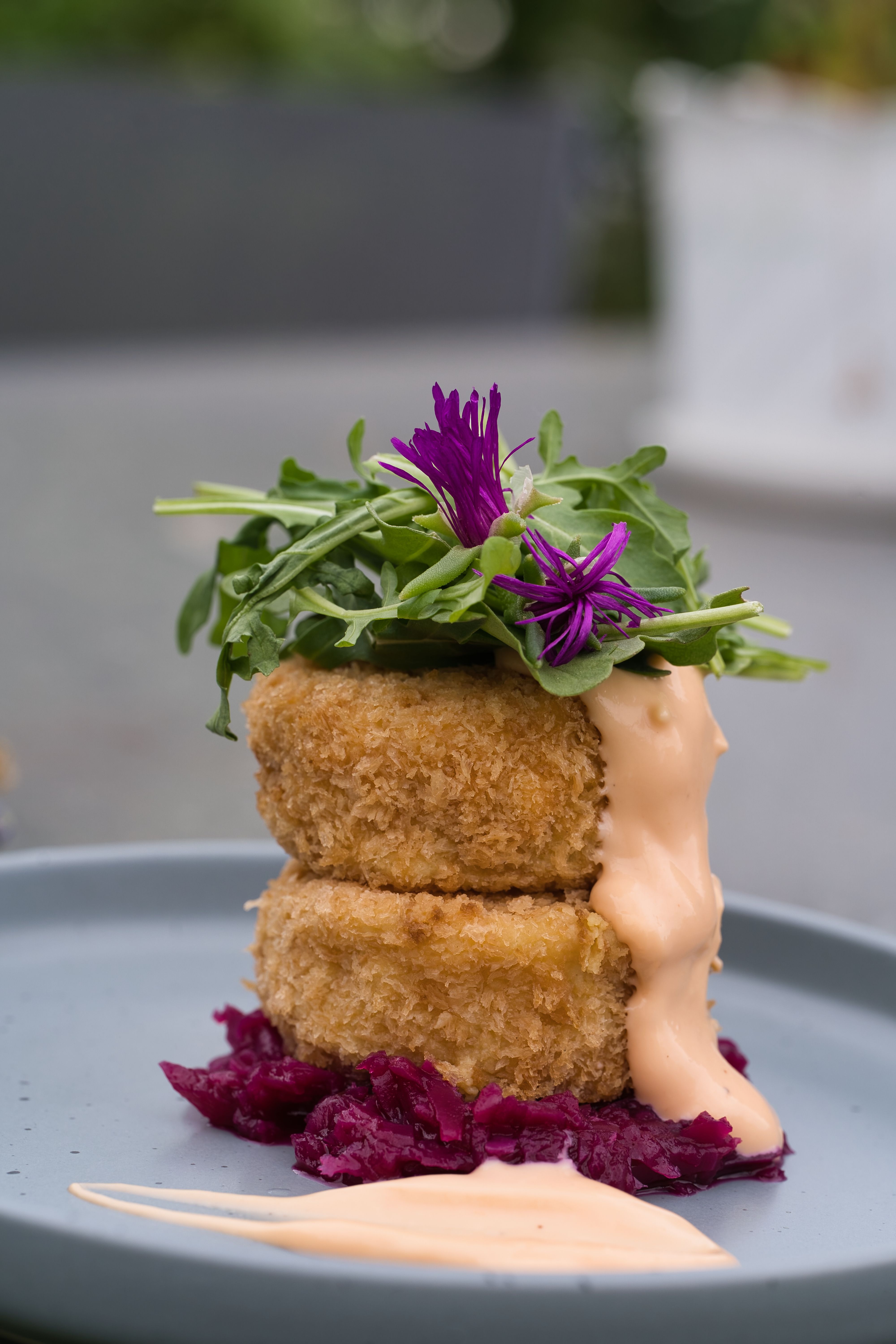 Elegant Stack of Crispy Croquettes with Greens · Free Stock Photo