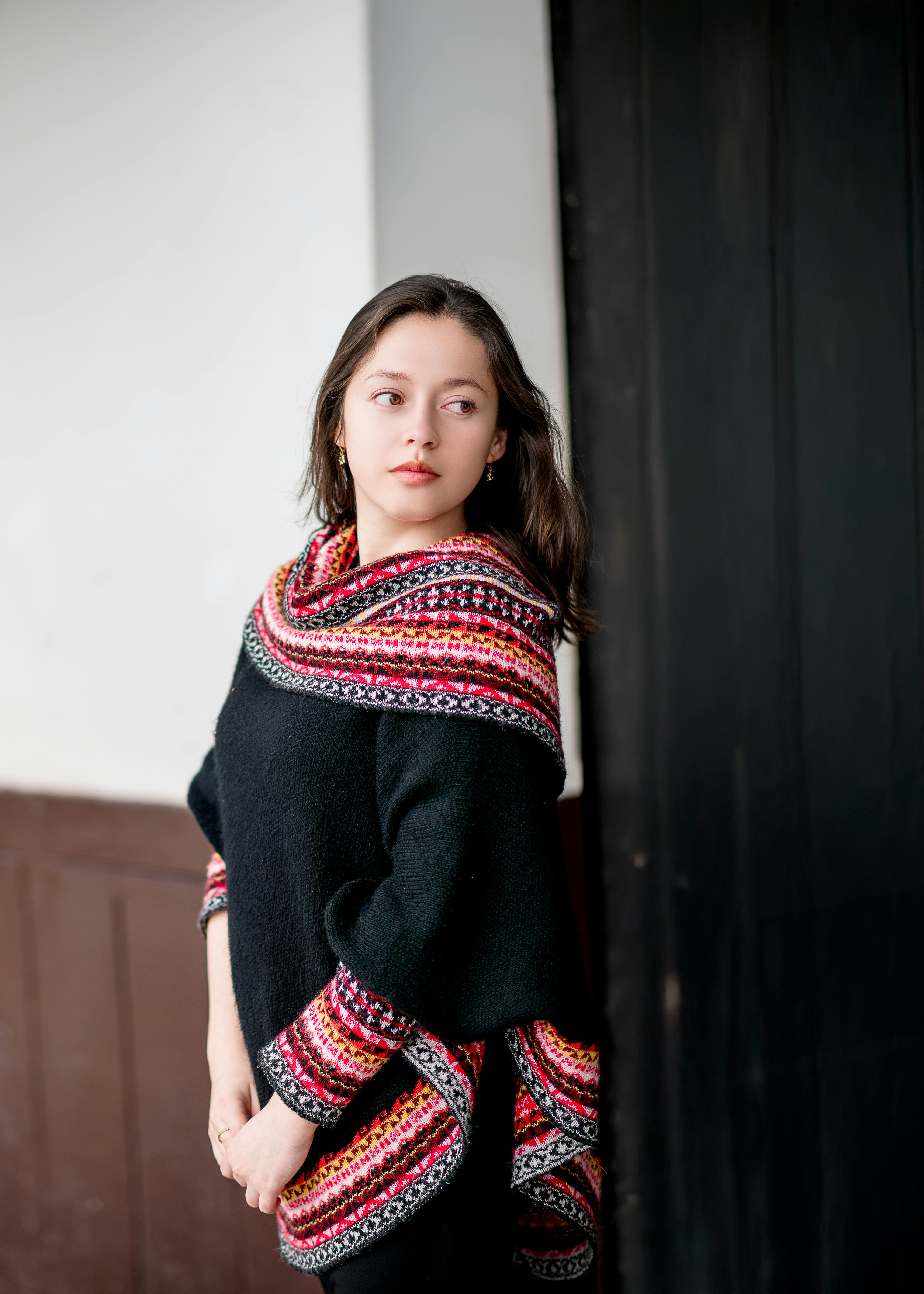 Young Woman in Colorful Andean Poncho · Free Stock Photo
