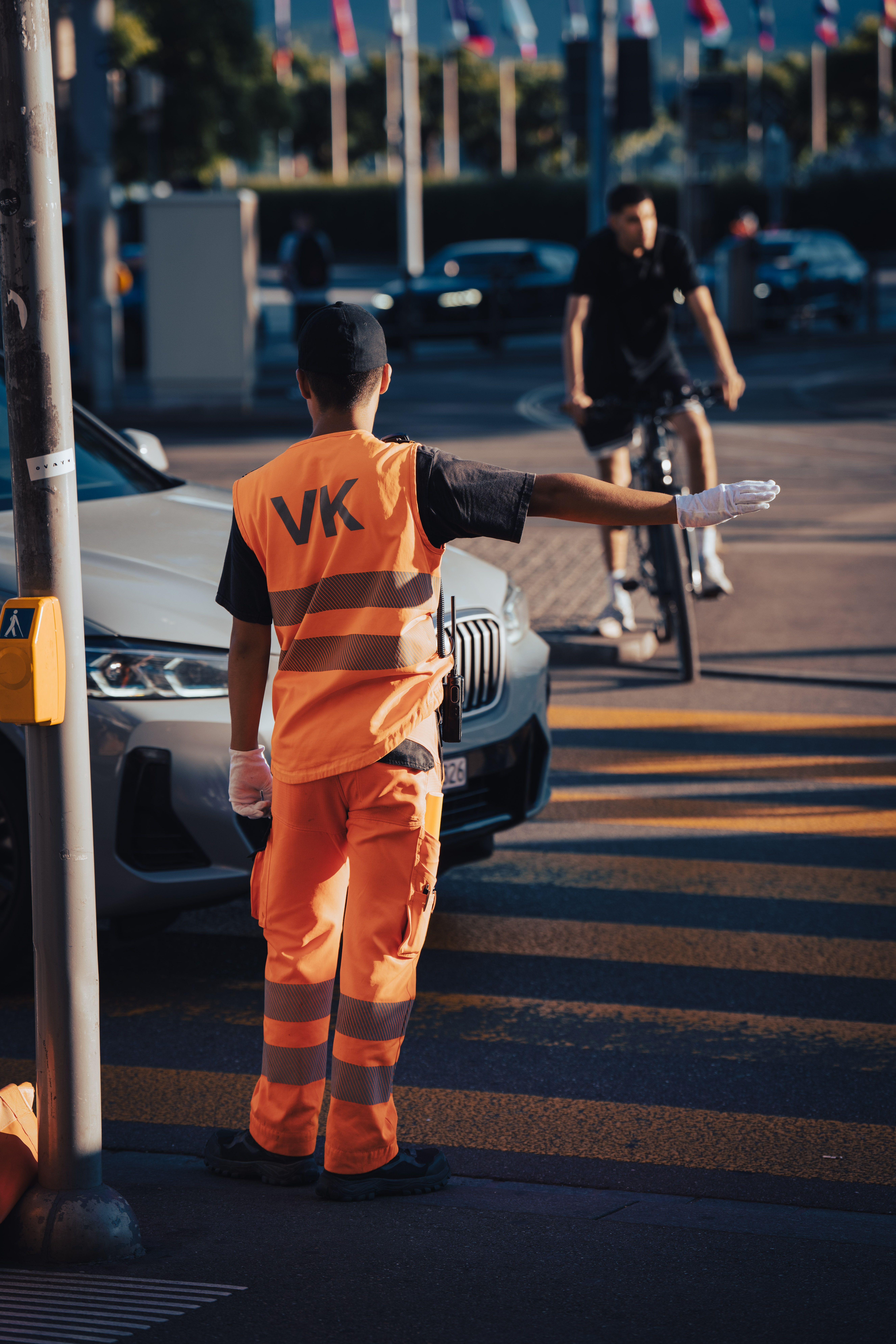 Traffic Warden Directing Traffic in Urban Setting · Free Stock Photo
