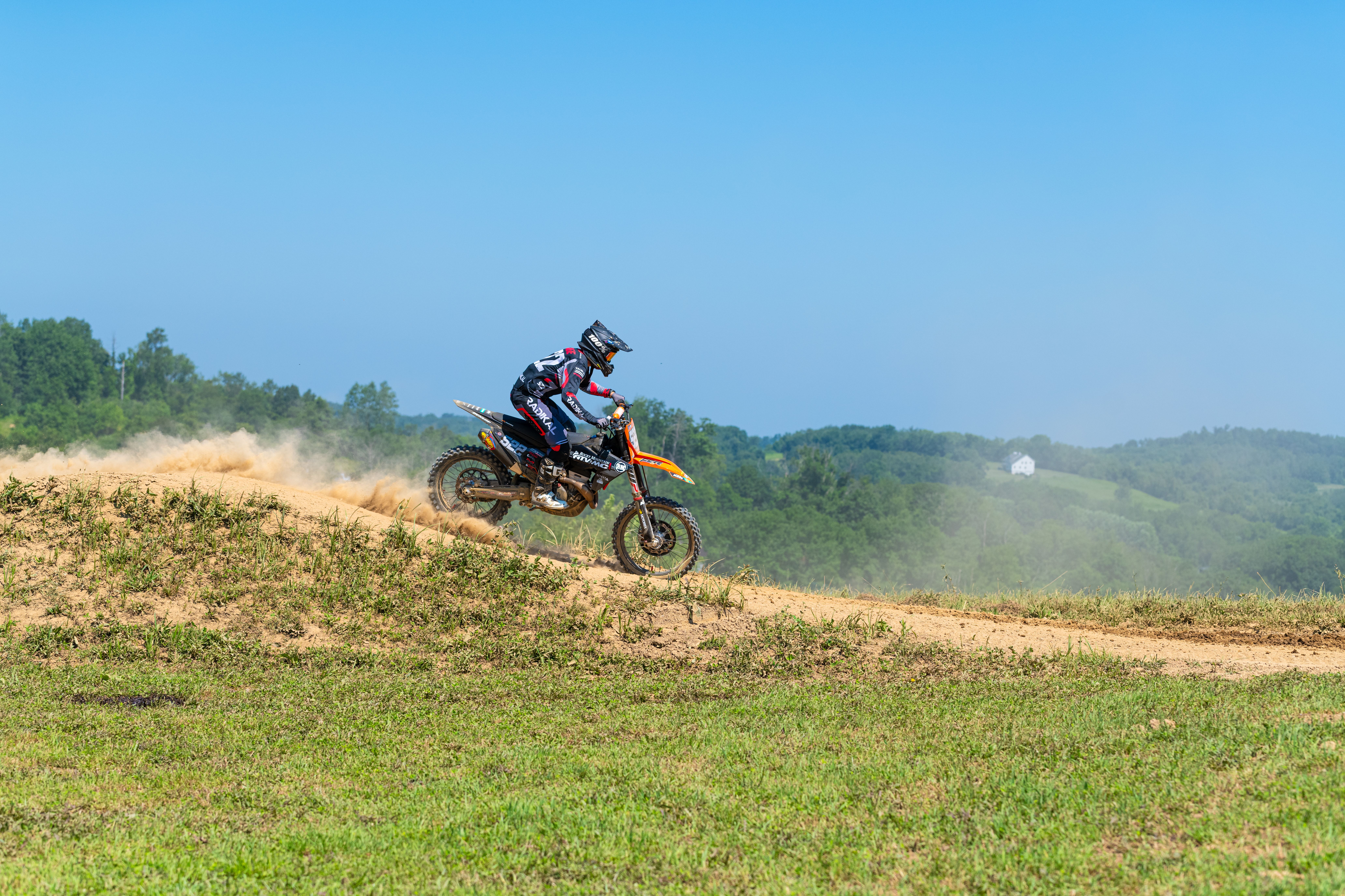 Motocross Rider on Dirt Track in Open Field · Free Stock Photo