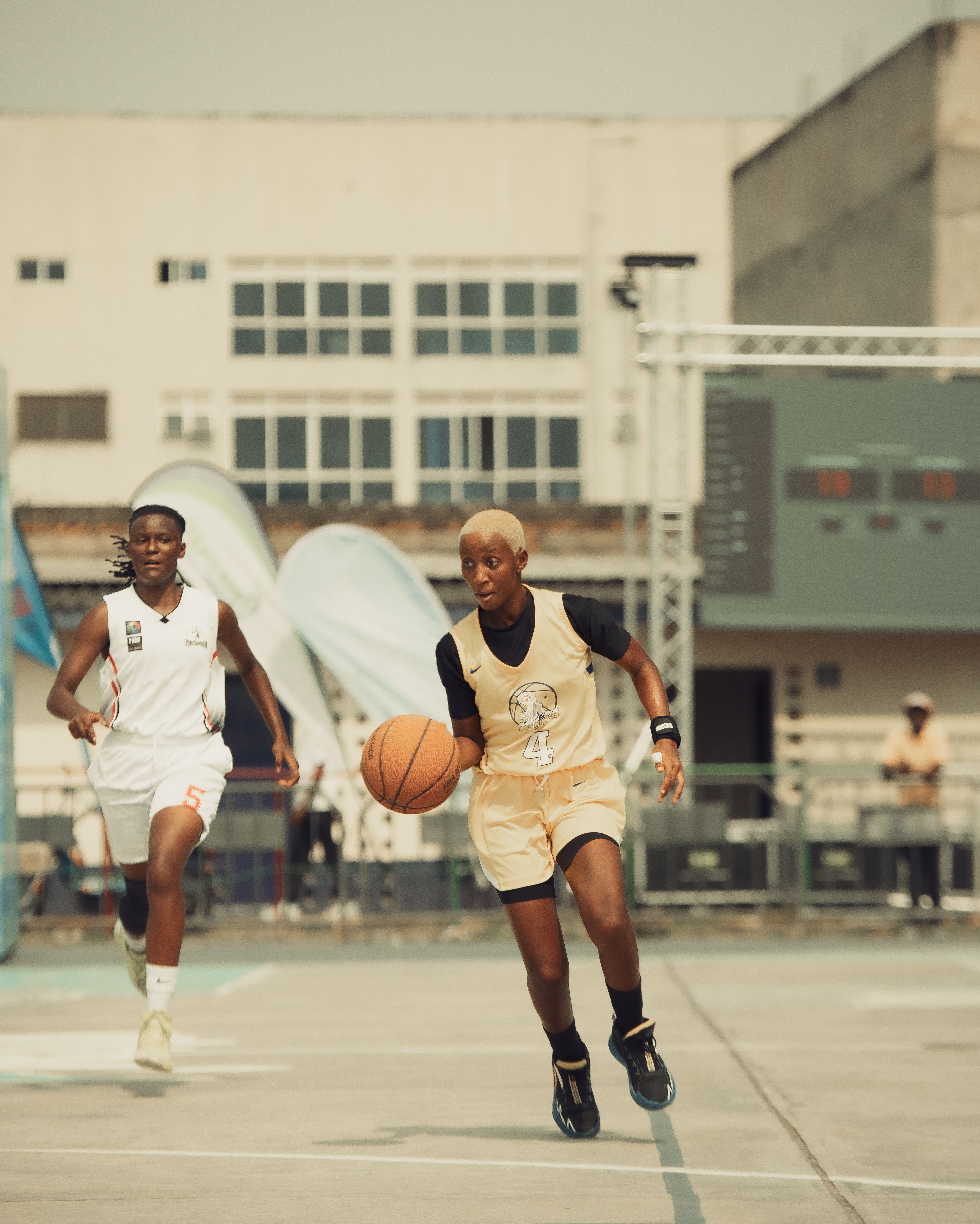 Dynamic Street Basketball Game in Urban Setting · Free Stock Photo