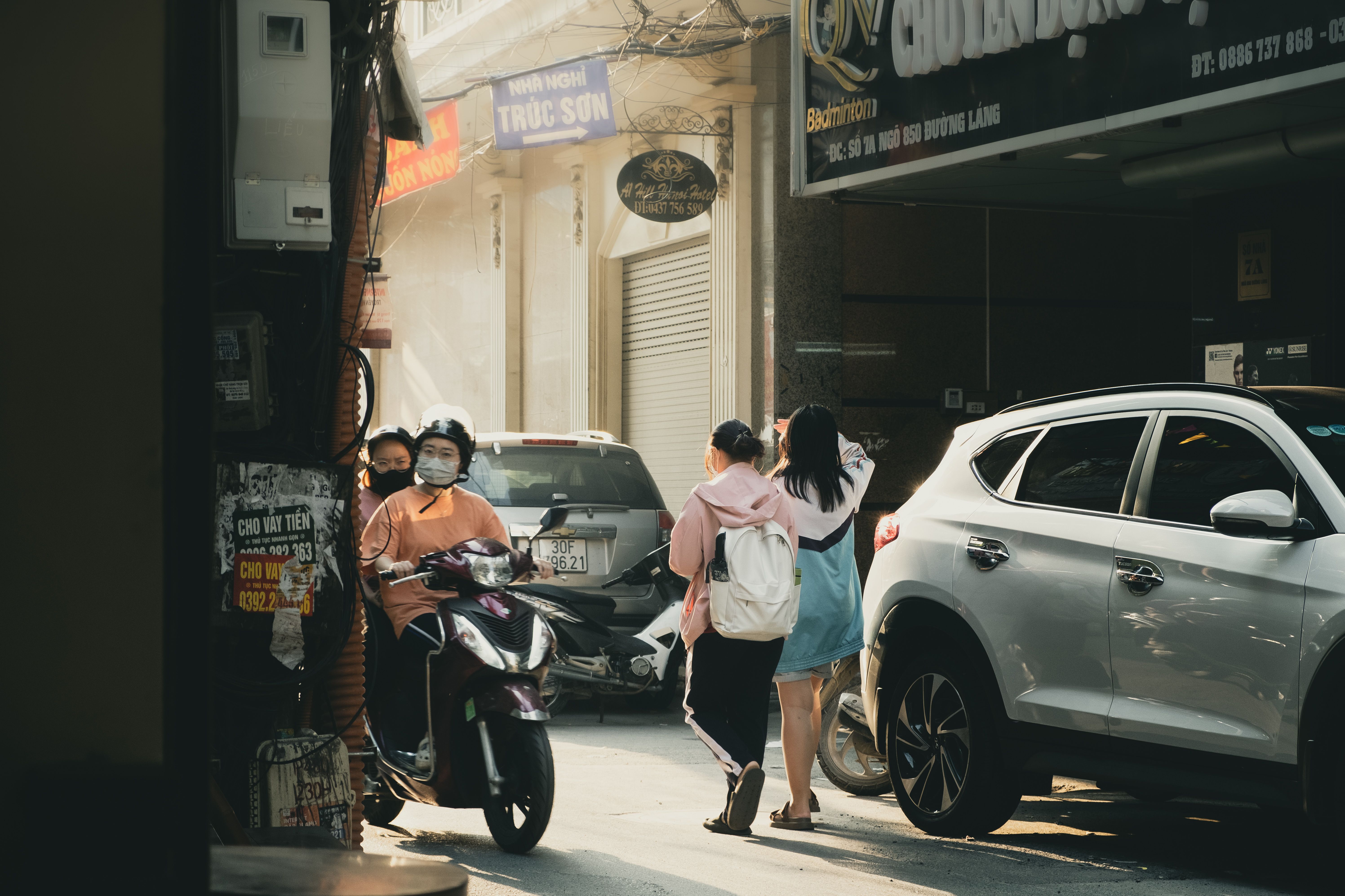 Street Scene with Motorcycle and Pedestrians · Free Stock Photo