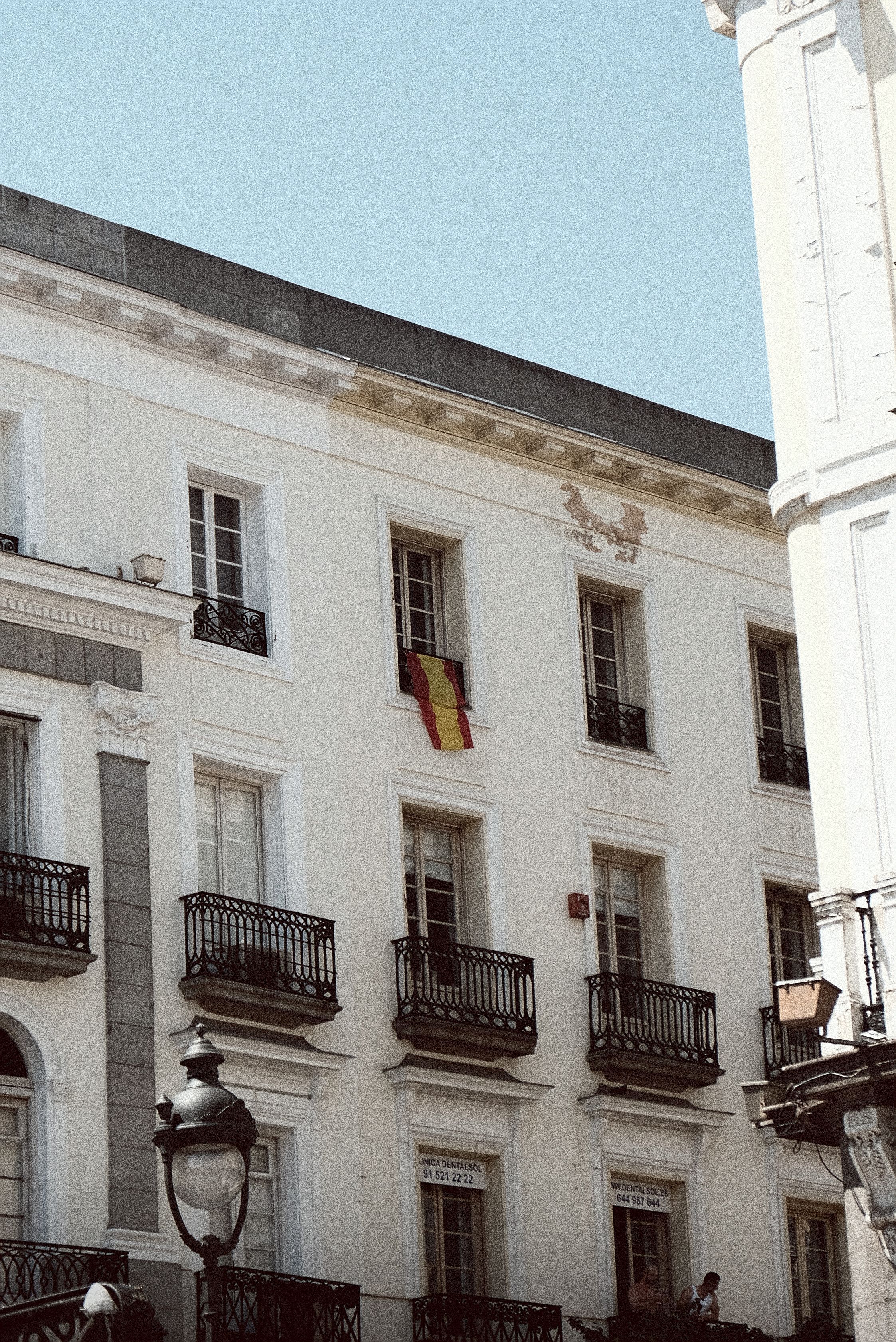 Elegant Madrid Building with Spanish Flag · Free Stock Photo