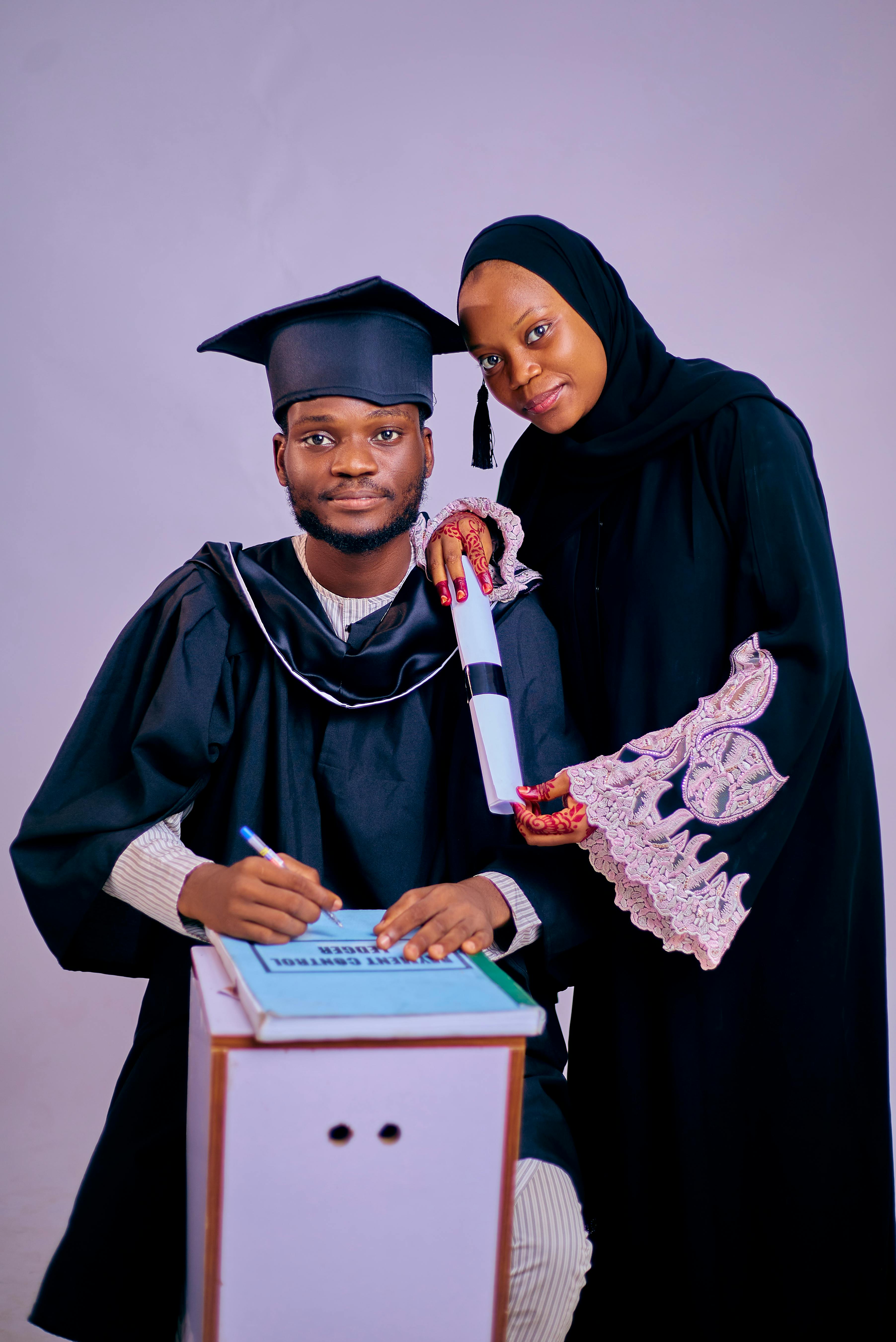 Celebratory Graduation Portrait with Diploma · Free Stock Photo