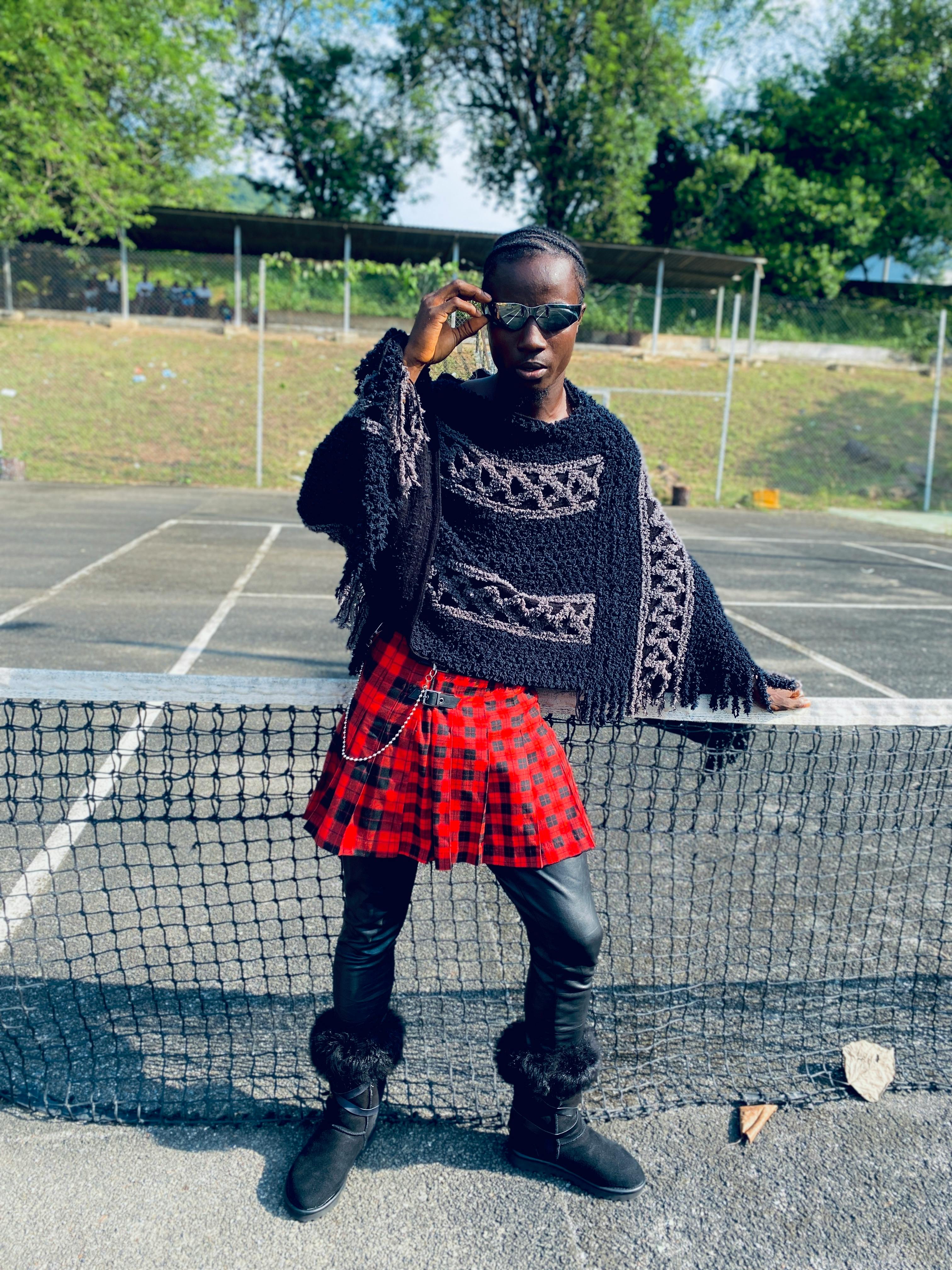 Fashionable Individual in Checkered Skirt Outdoors · Free Stock Photo
