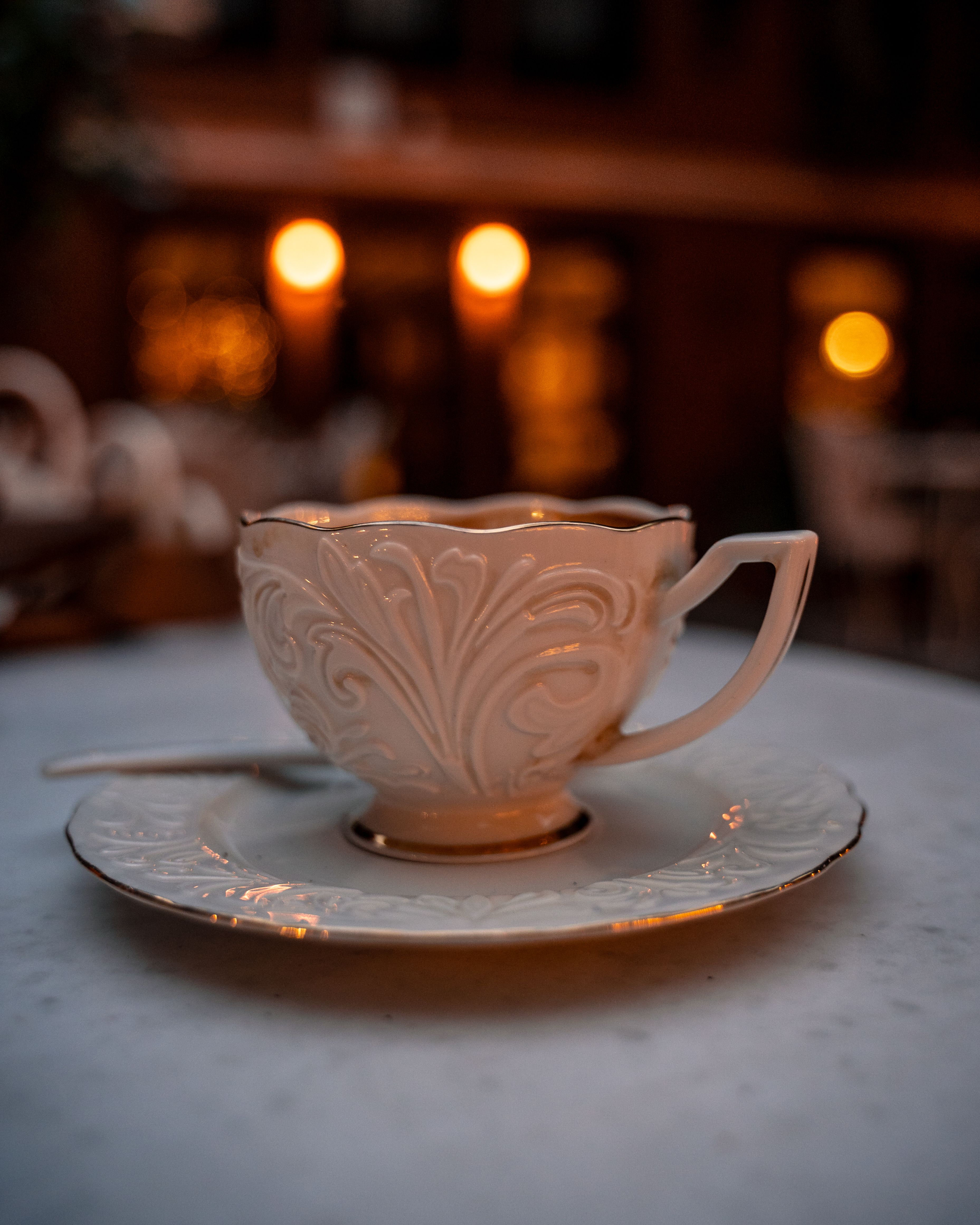 Elegant White Coffee Cup with Intricate Detail · Free Stock Photo
