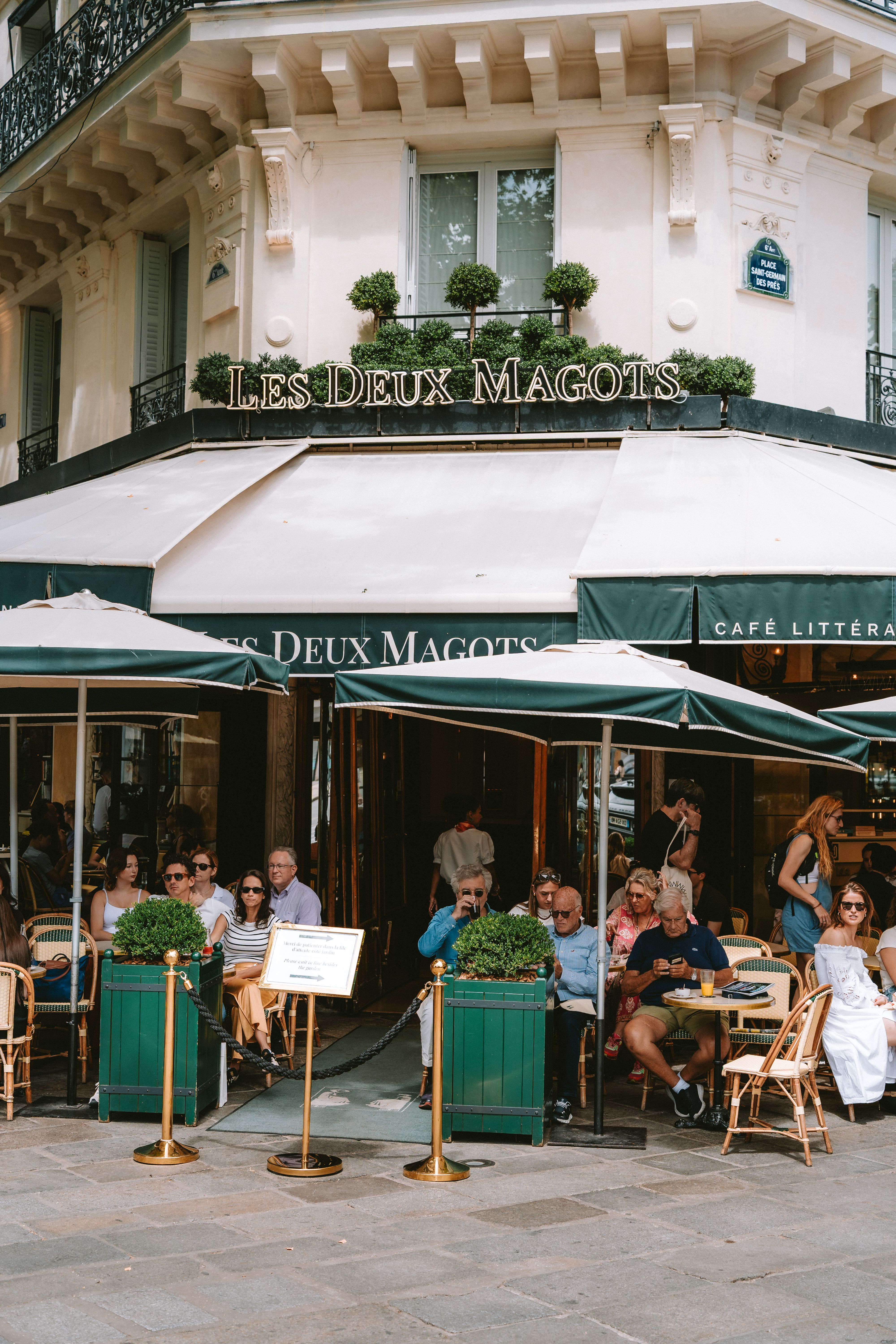 Lively Cafe Scene at Les Deux Magots, Paris · Free Stock Photo