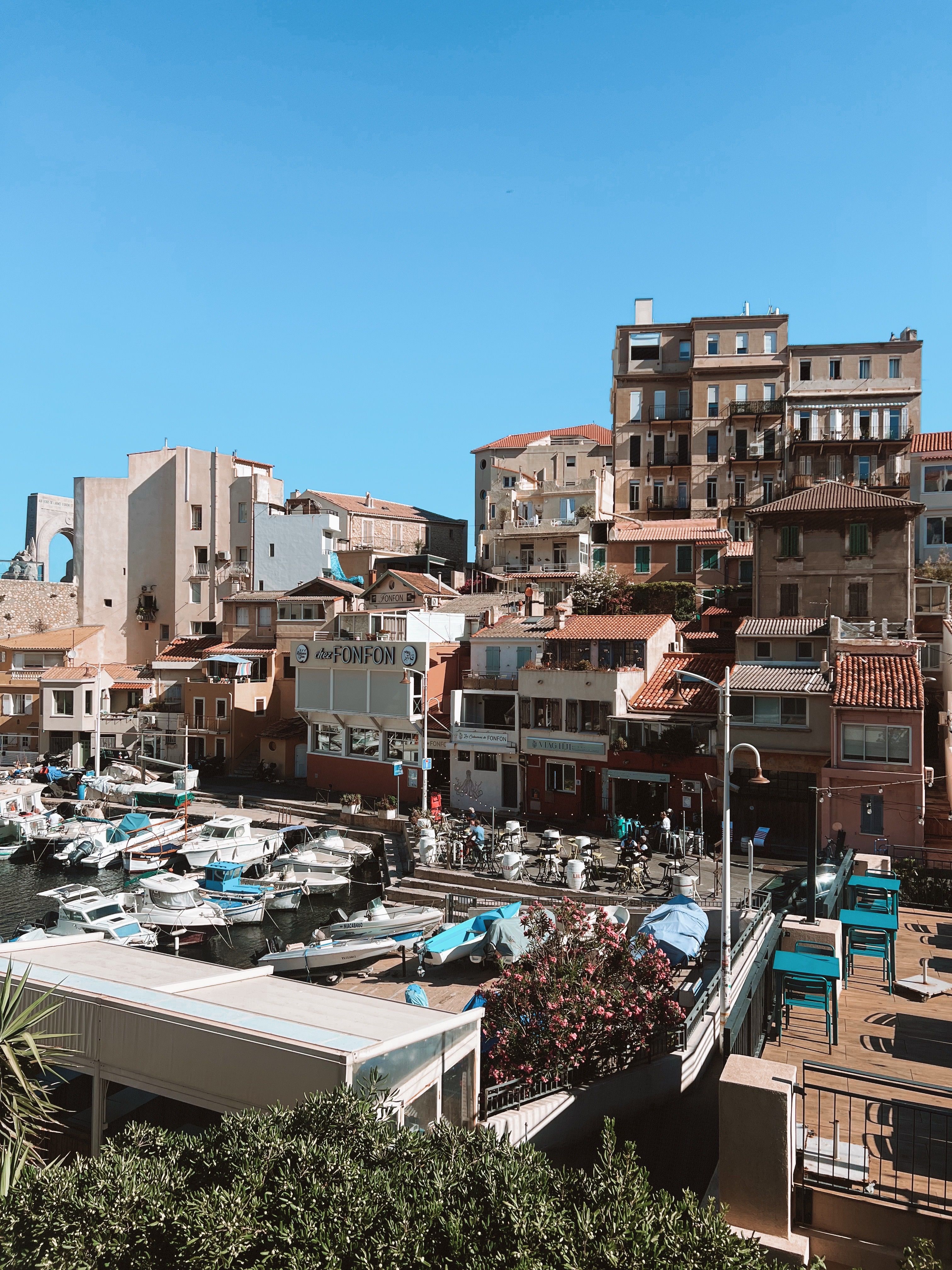 Charming Italian Port with Colorful Boats and Buildings · Free Stock Photo