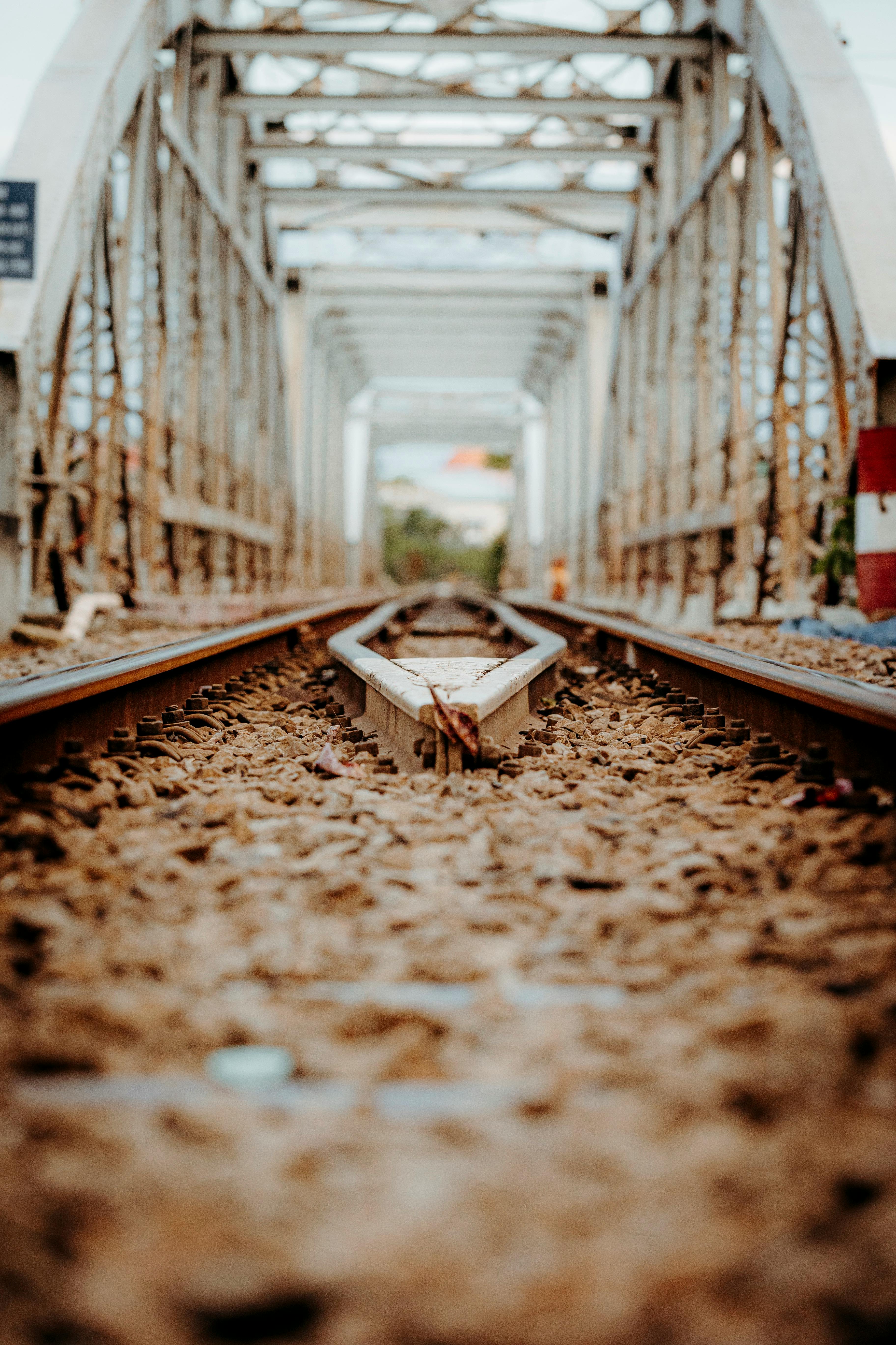 Rustic Railway Bridge with Train Tracks Perspective · Free Stock Photo