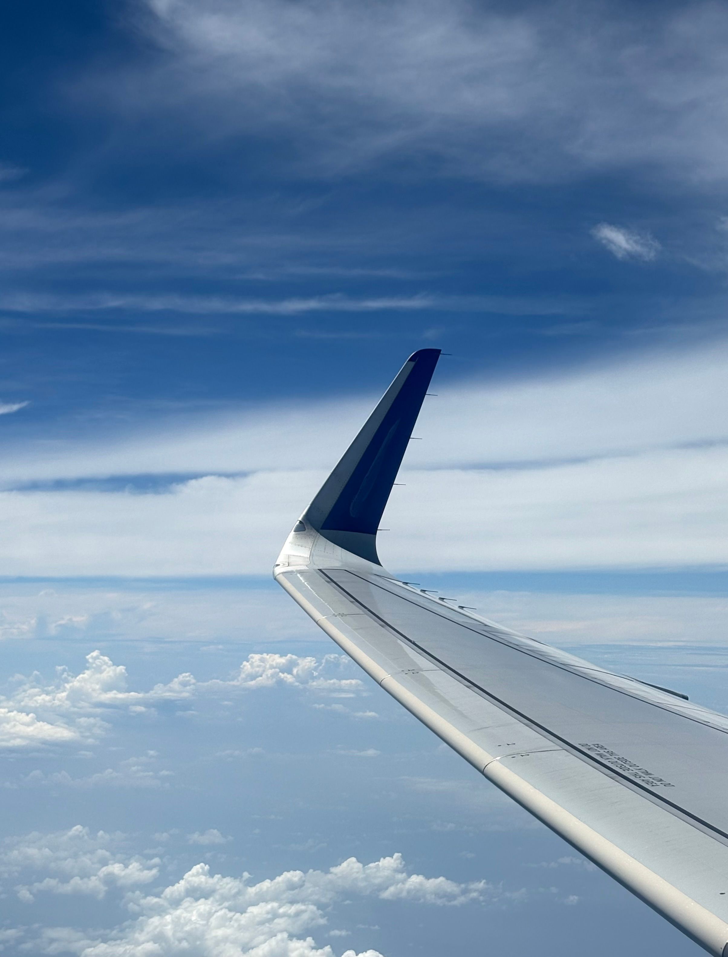 Airplane Wing View Above the Clouds · Free Stock Photo