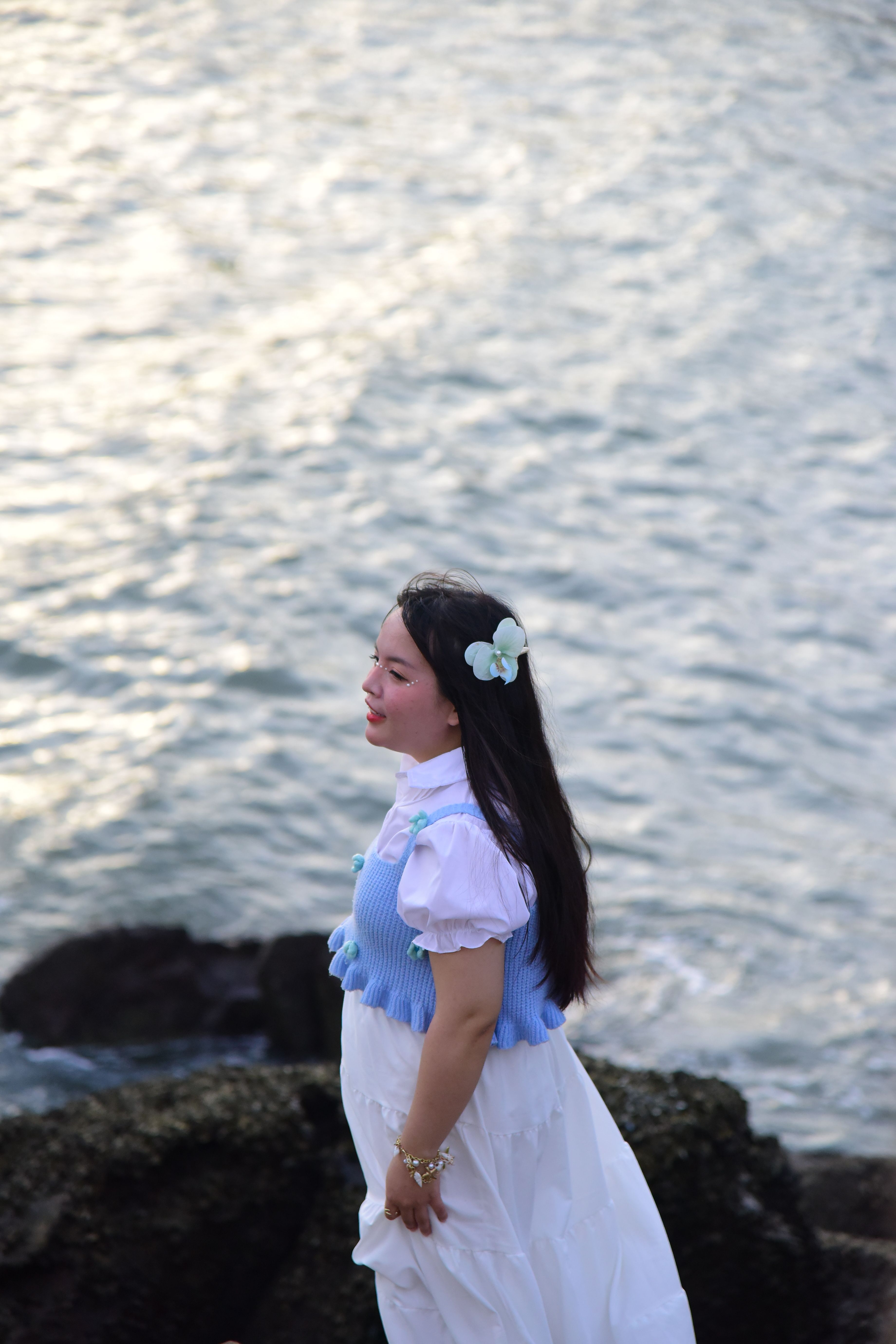 Woman in Blue Top by the Ocean at Sunset · Free Stock Photo