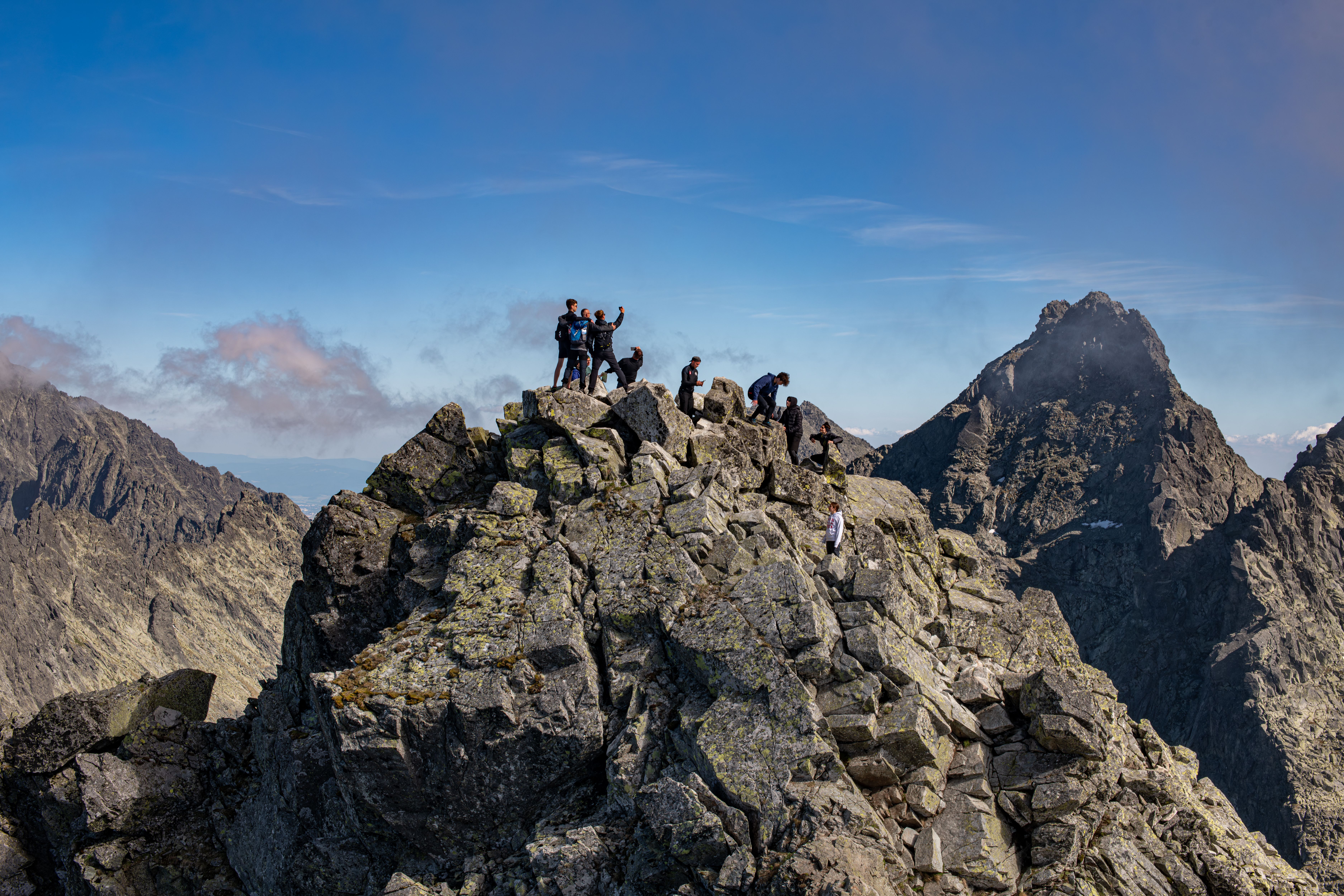 Hikers Reach Summit of Rysy Mountain Peak · Free Stock Photo