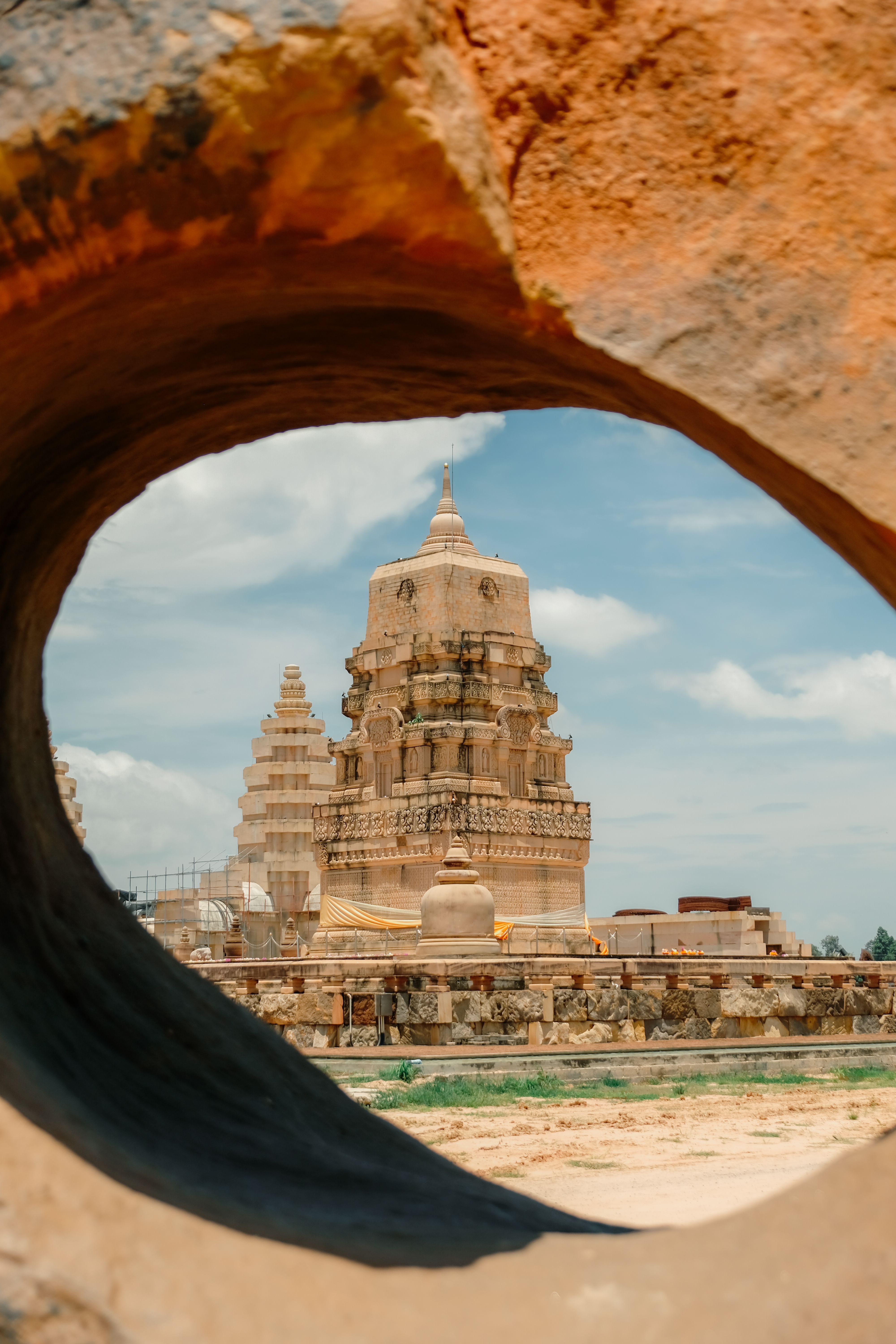 Stunning View of Indian Temple Through Rock Arch · Free Stock Photo