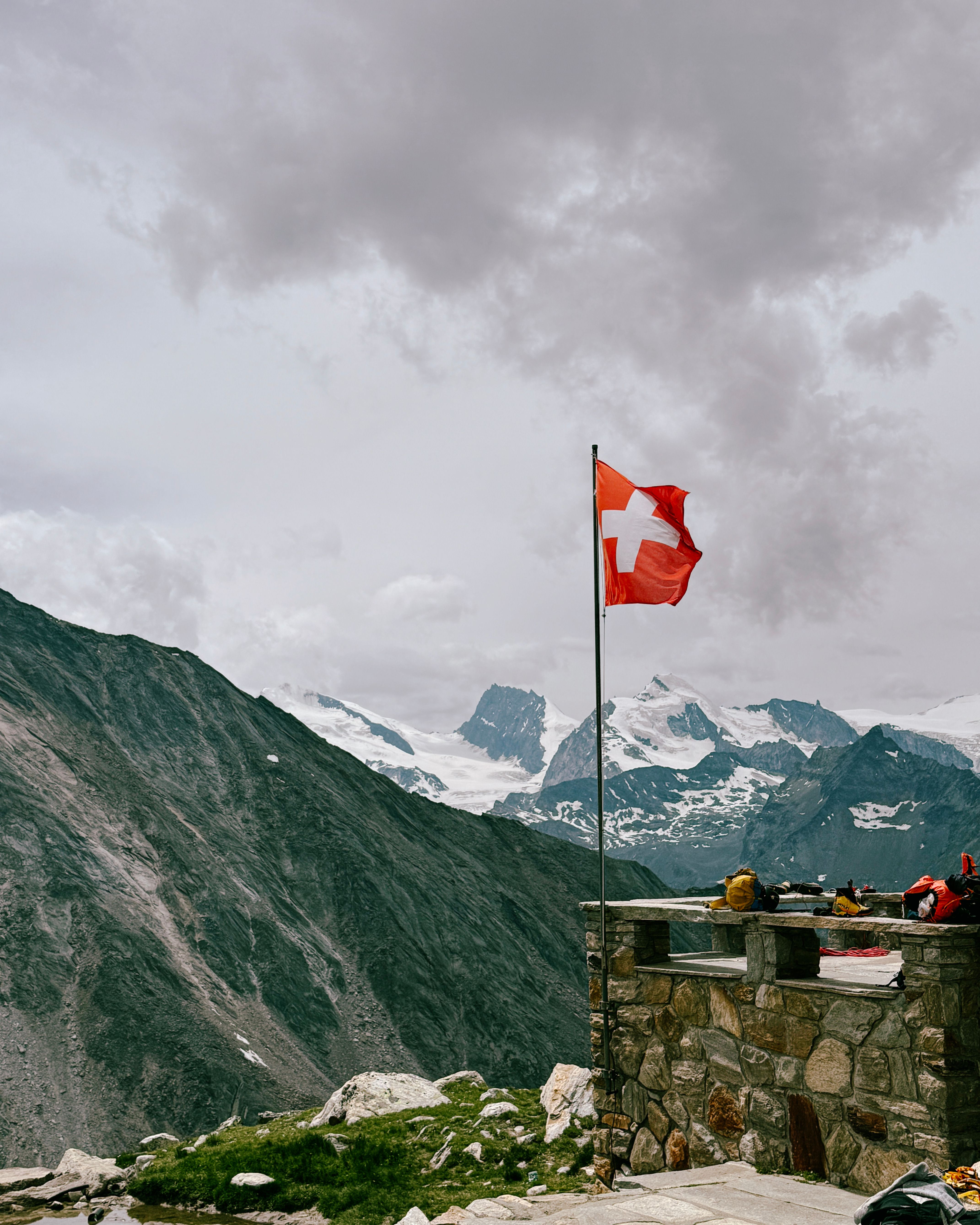 Breathtaking Swiss Alps View with Flag · Free Stock Photo
