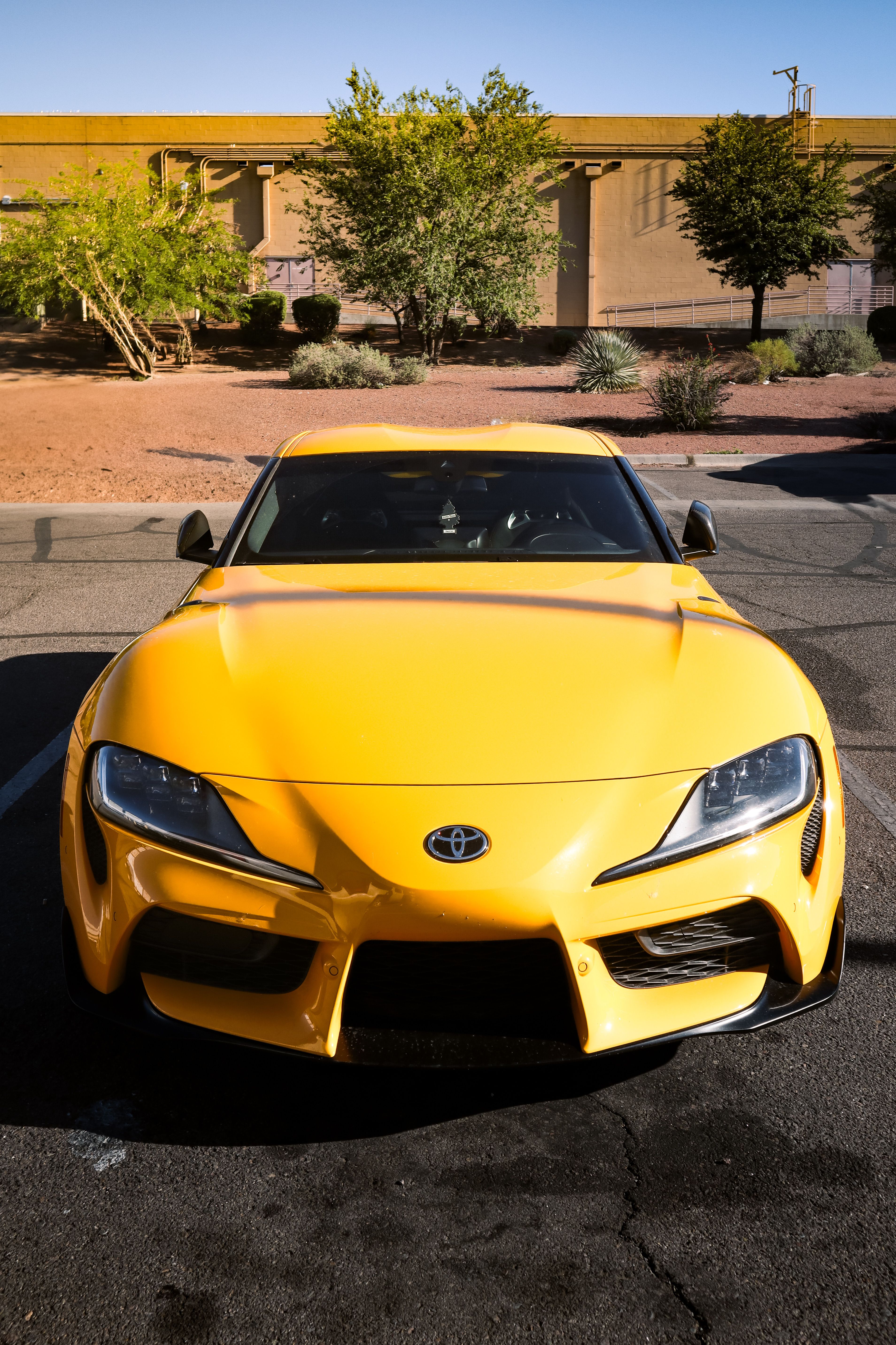 Bright Yellow Sports Car in Urban Setting · Free Stock Photo