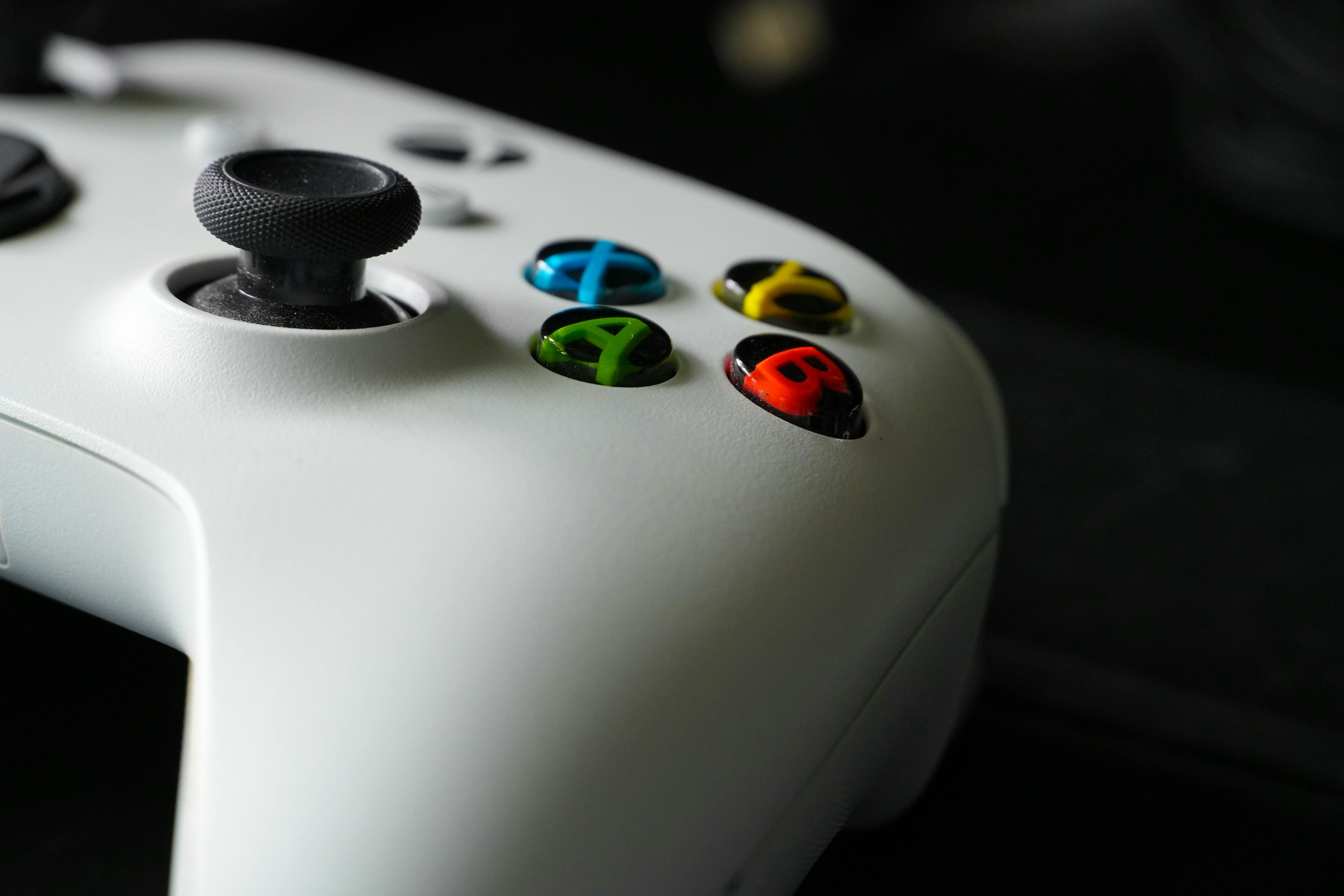 Xbox One Controller Beside Three Xbox One Cases · Free Stock Photo