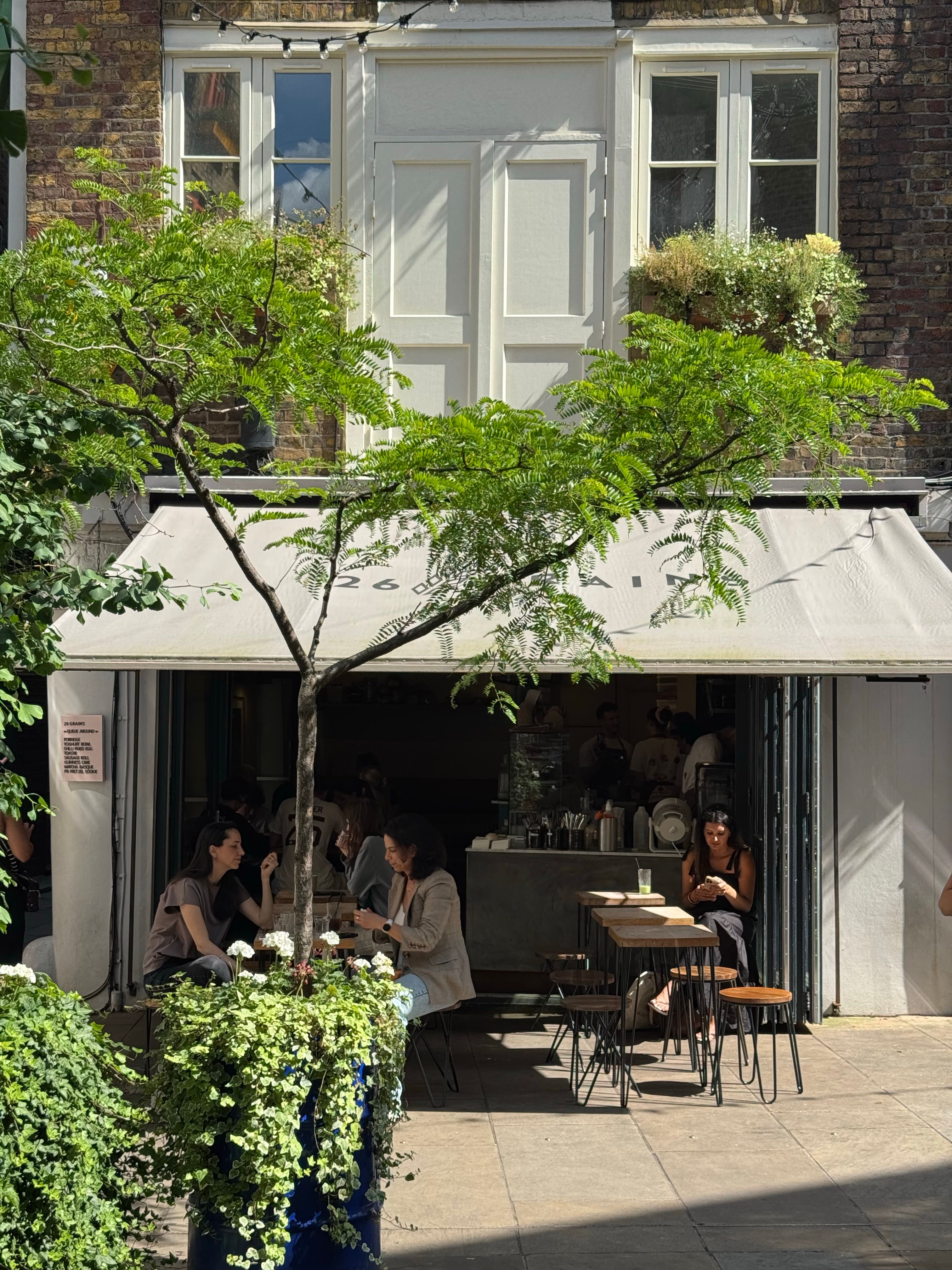 Charming Outdoor Cafe on a Sunny Day · Free Stock Photo