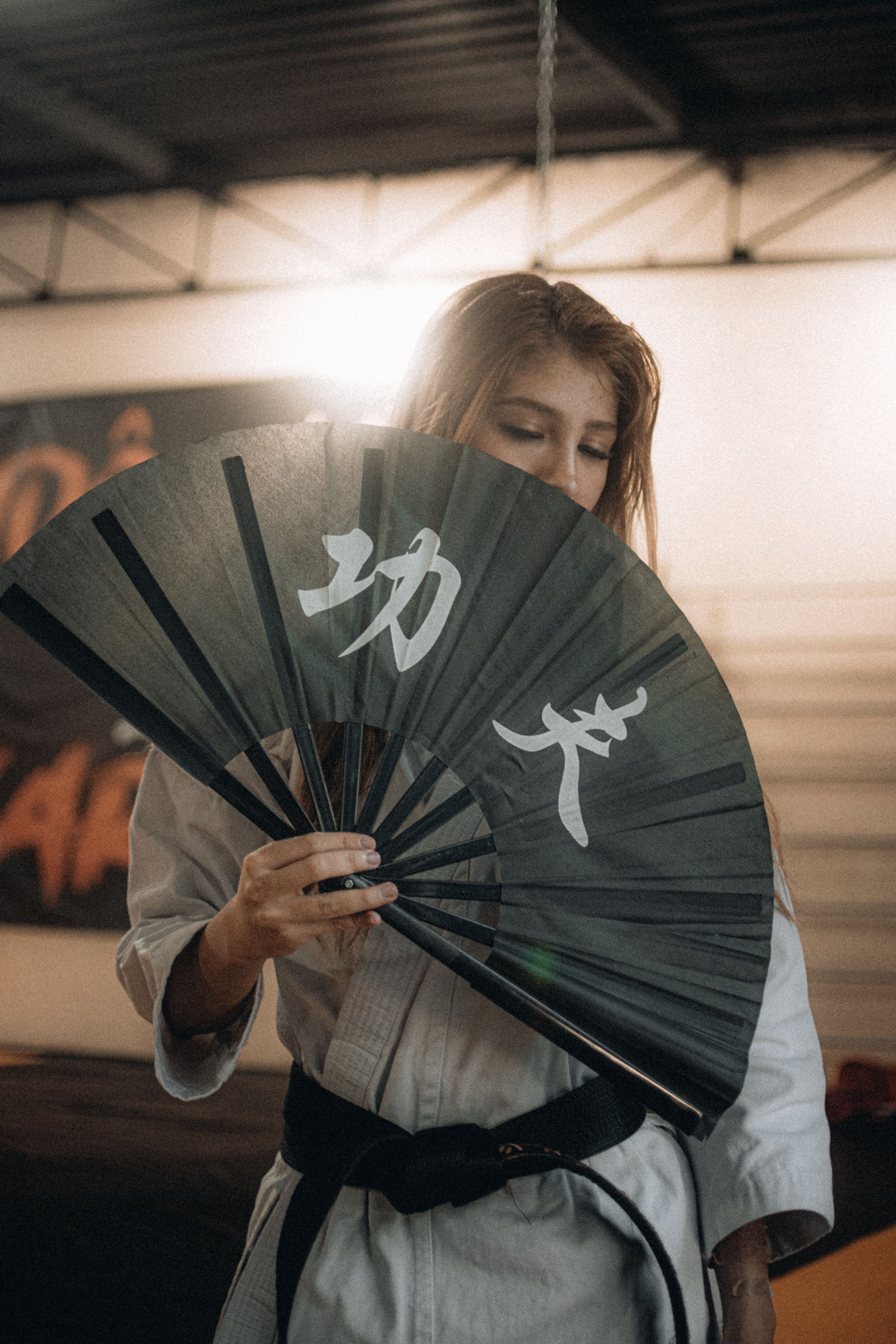 Martial Artist Holding Traditional Chinese Fan · Free Stock Photo