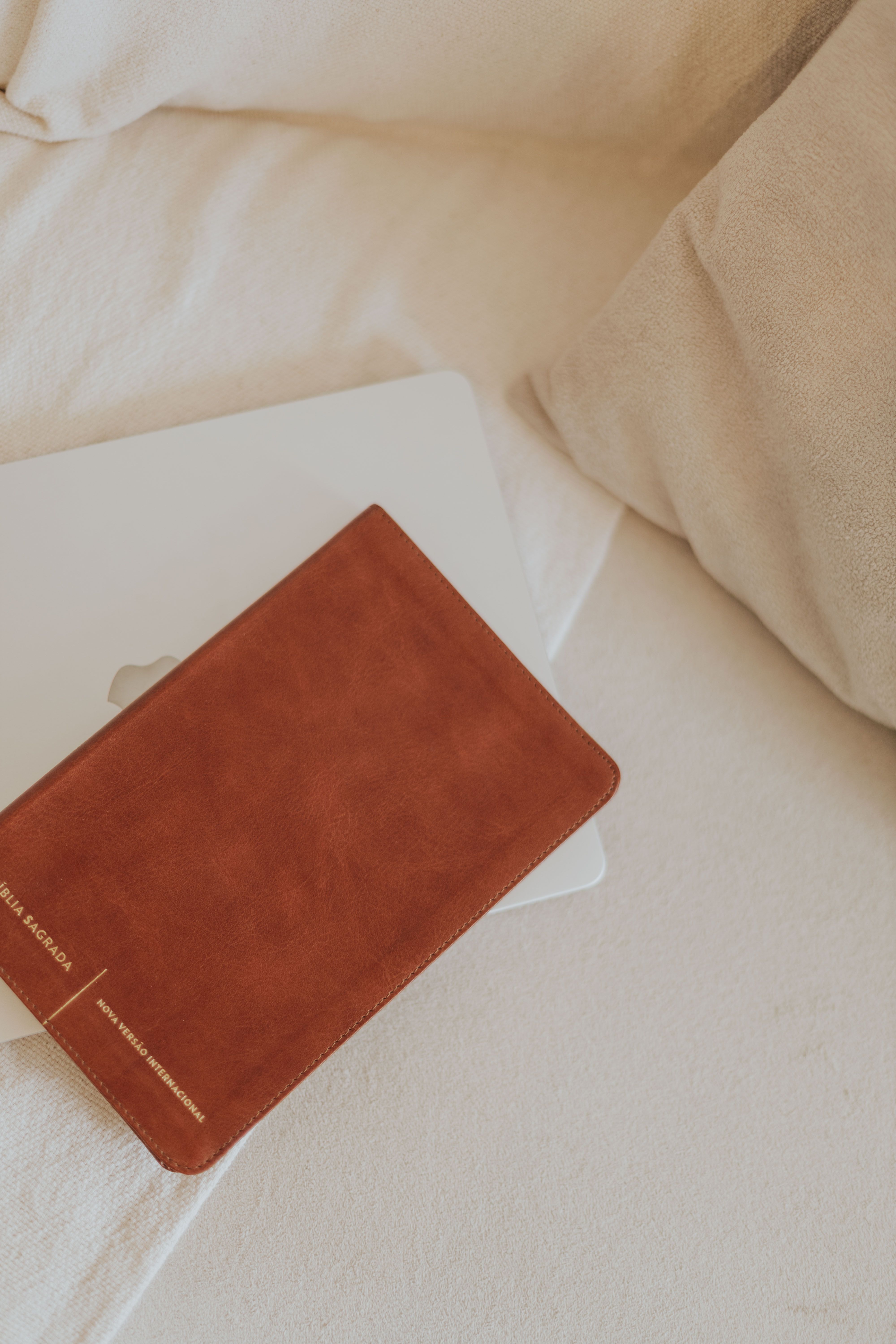 Bible on Laptop with Soft Beige Tones · Free Stock Photo