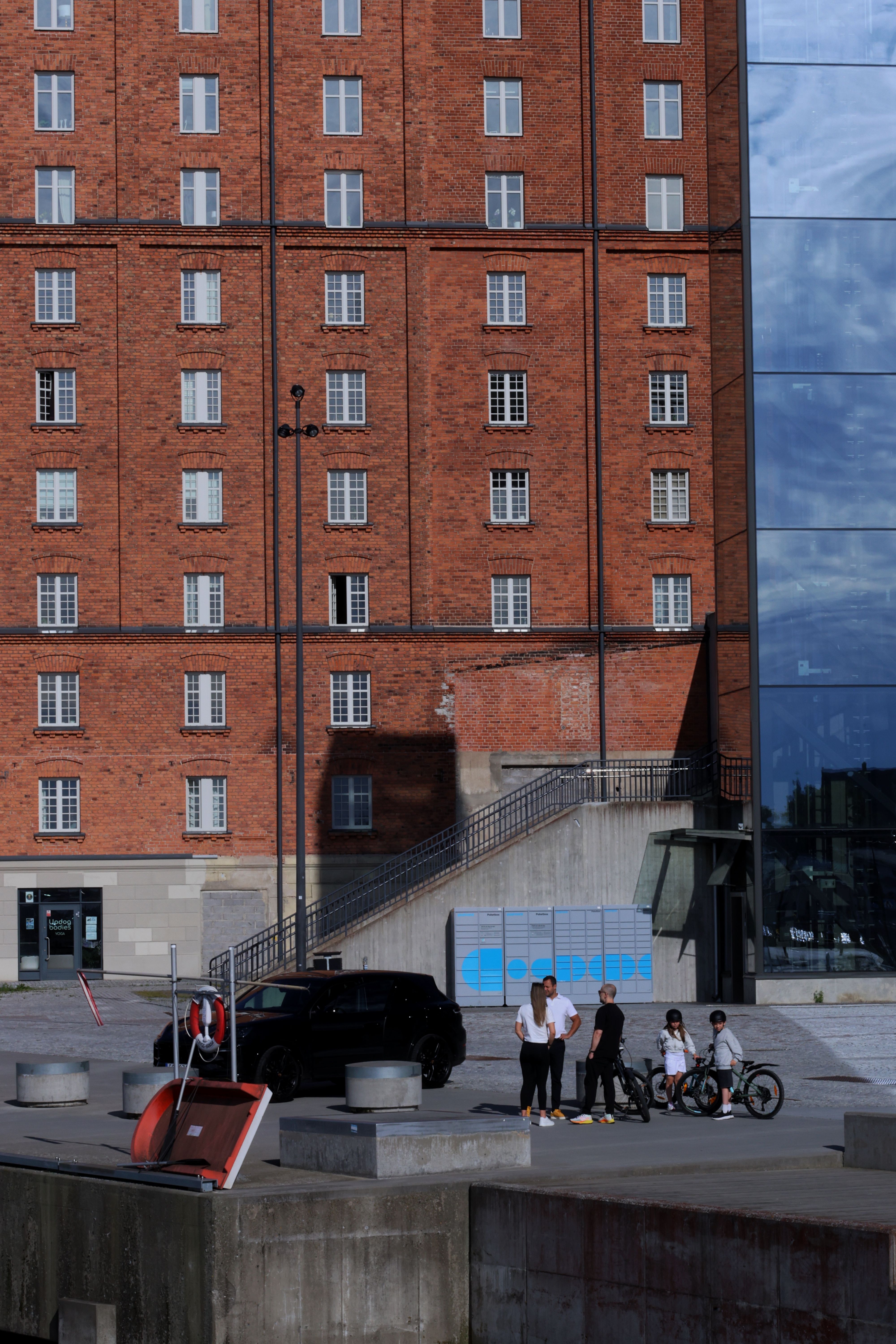 Urban Scene with Red Brick Building in Stockholm · Free Stock Photo
