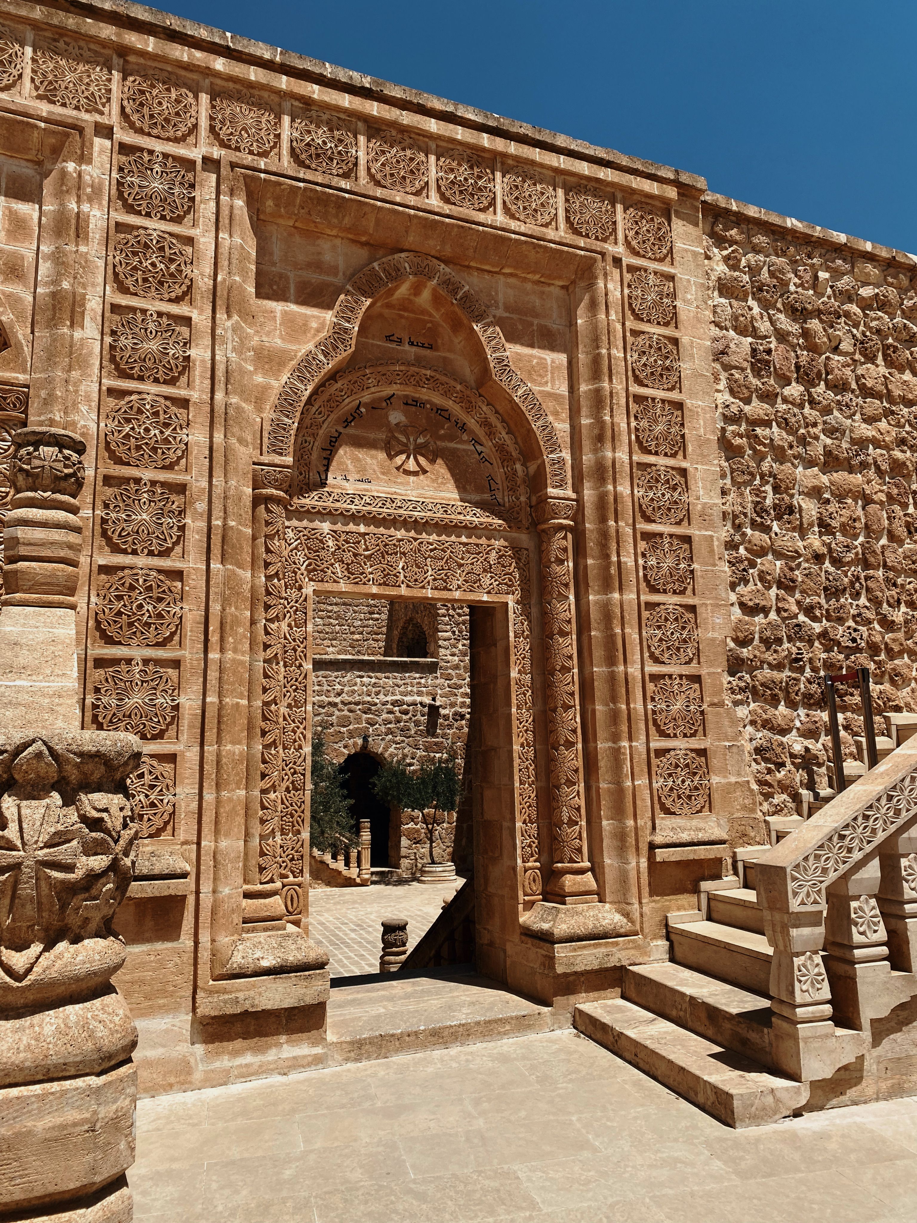 Ancient Stone Architecture with Ornate Arch Design · Free Stock Photo