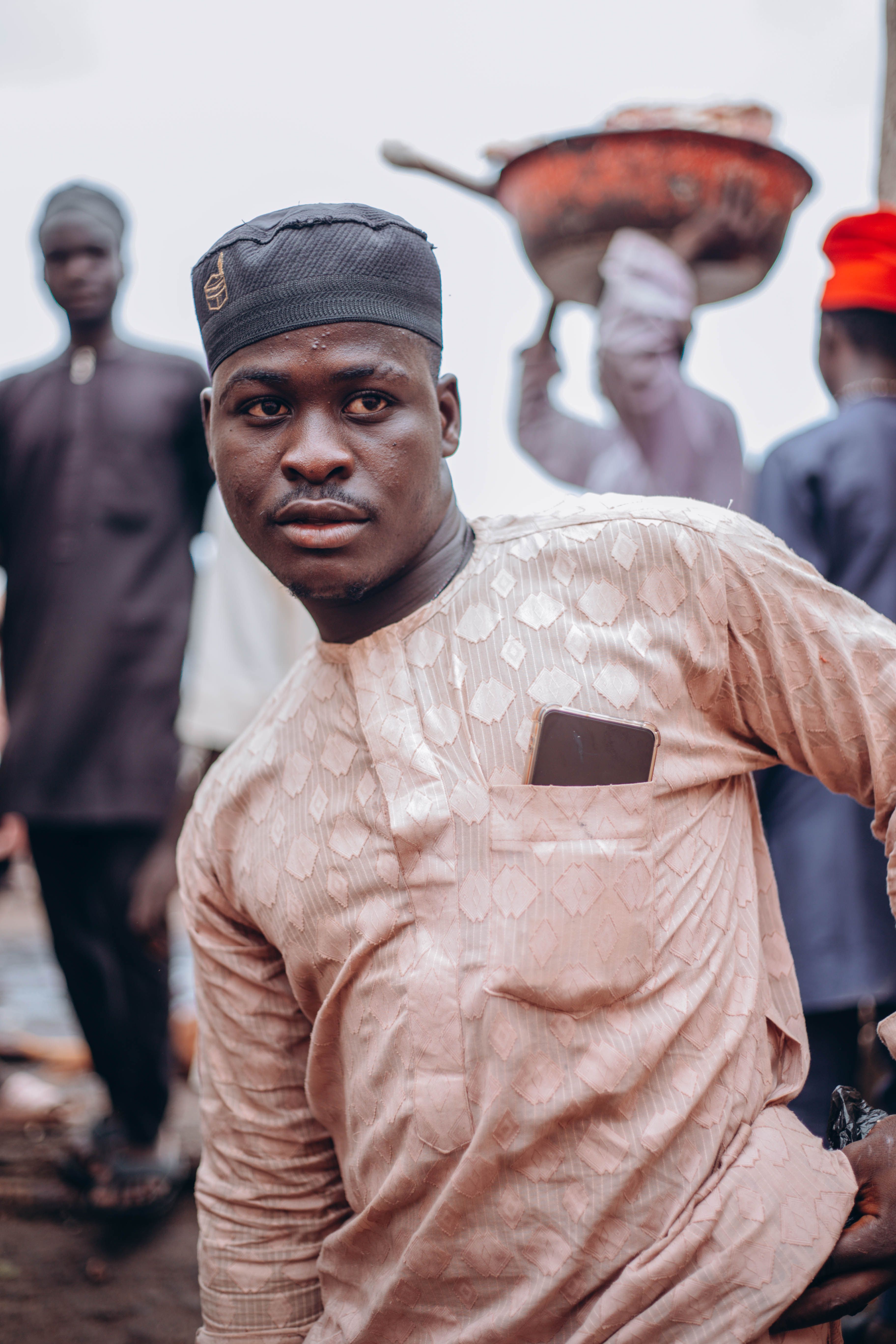 Traditional Nigerian Attire in Vibrant Street Scene · Free Stock Photo