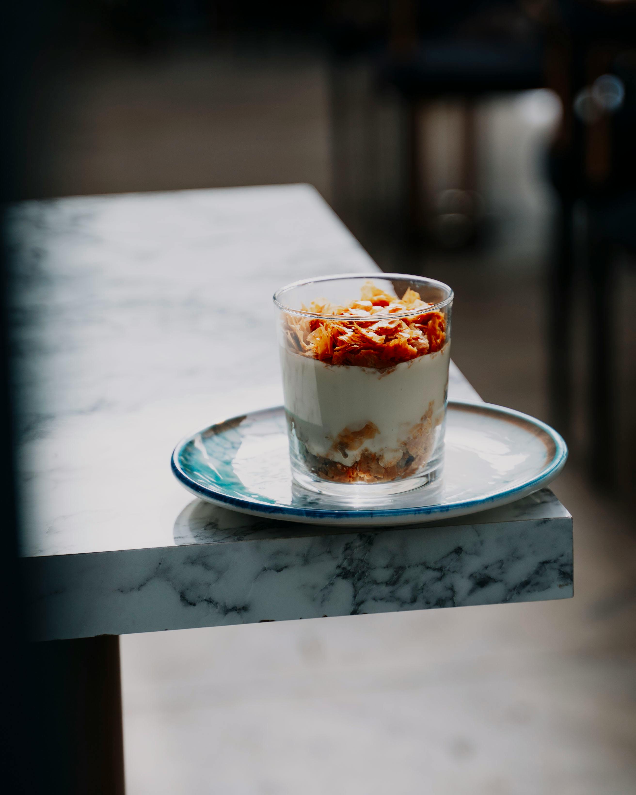 Delicious Layered Yogurt Parfait on Marble Table · Free Stock Photo