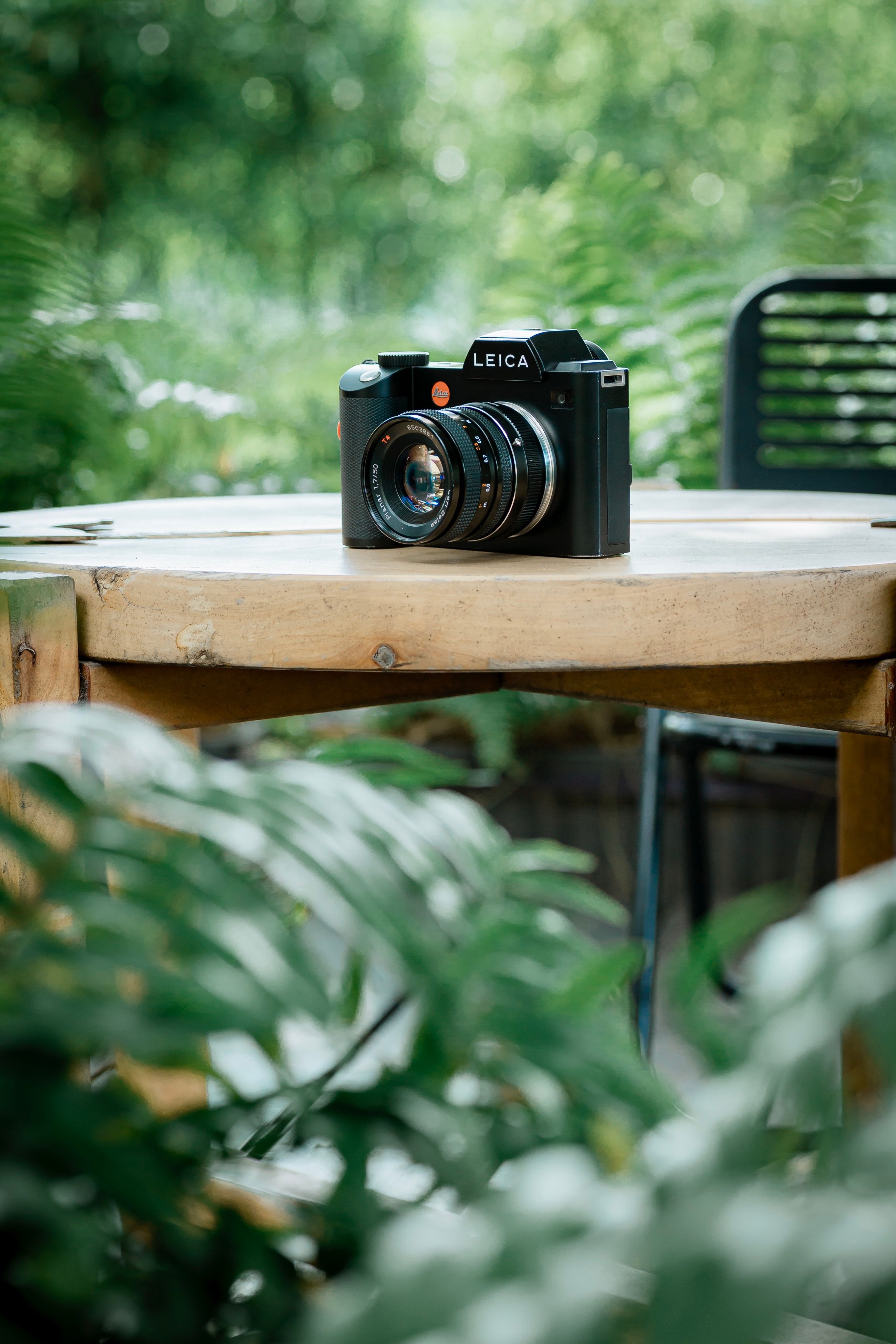 Vintage Camera on Wooden Table Outdoors · Free Stock Photo
