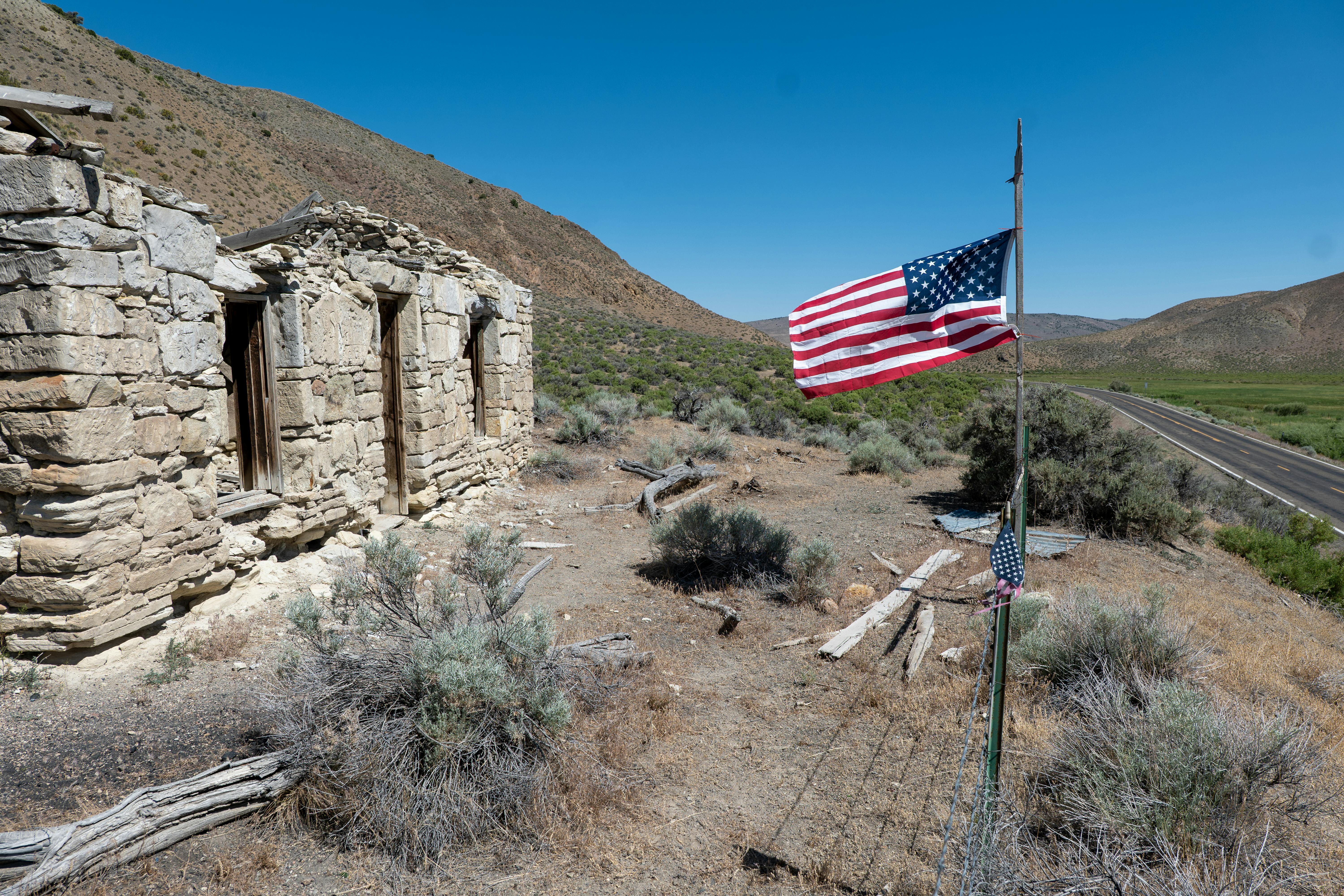 Deserted Stone Building with American Flag · Free Stock Photo