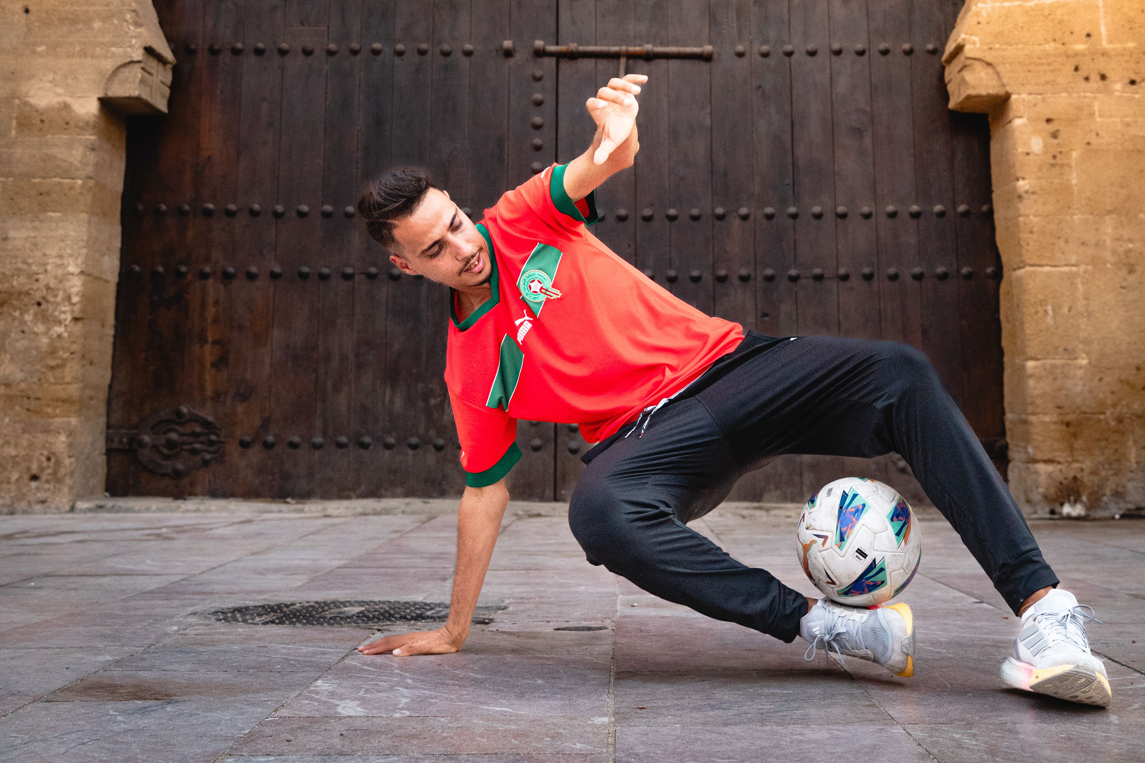 Urban Freestyle Soccer Player Performing Tricks Outdoors · Free Stock Photo