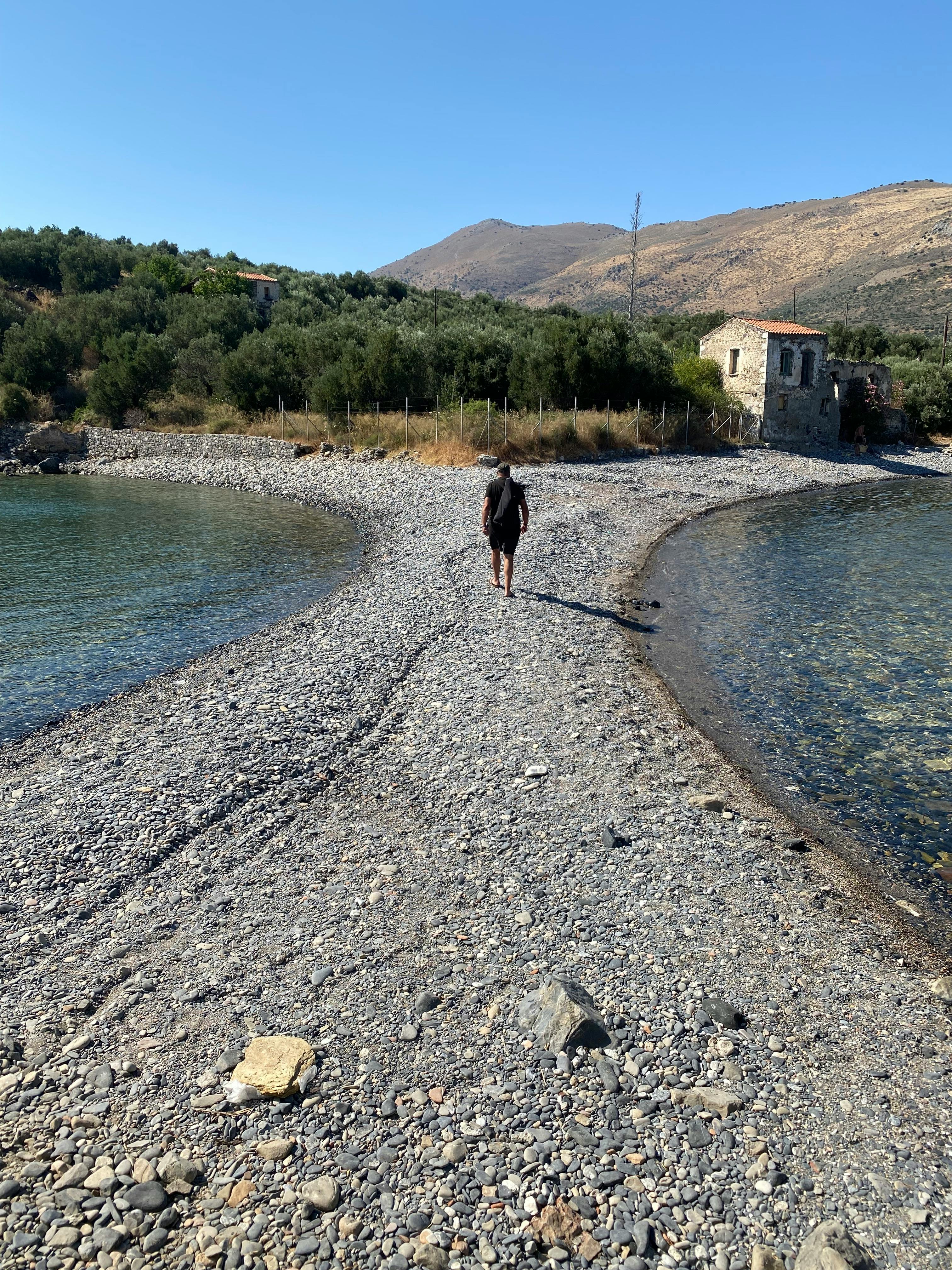 Solitary Walk on Remote Greek Pebble Beach · Free Stock Photo