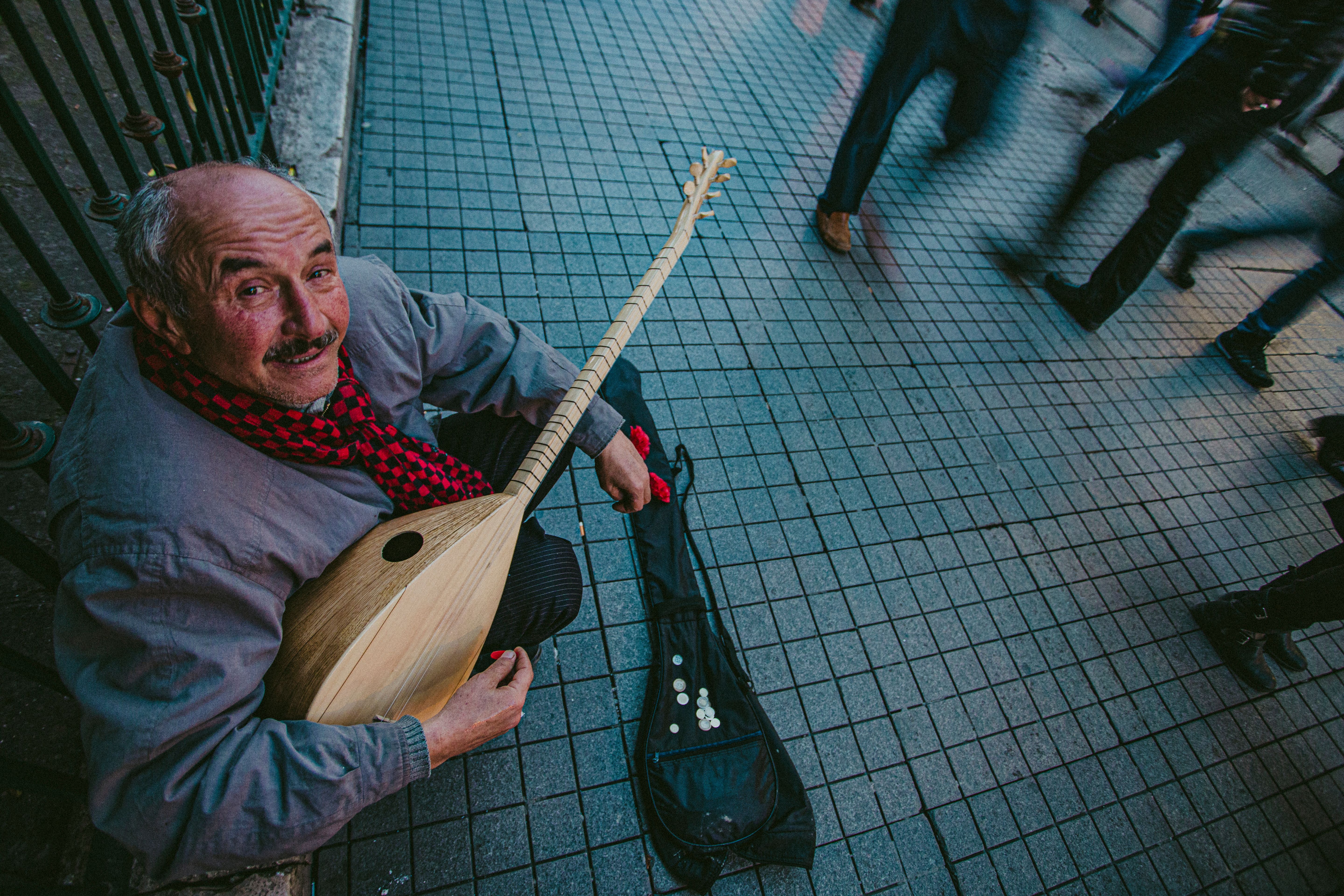 Street Musician Playing String Instrument in Istanbul · Free Stock Photo