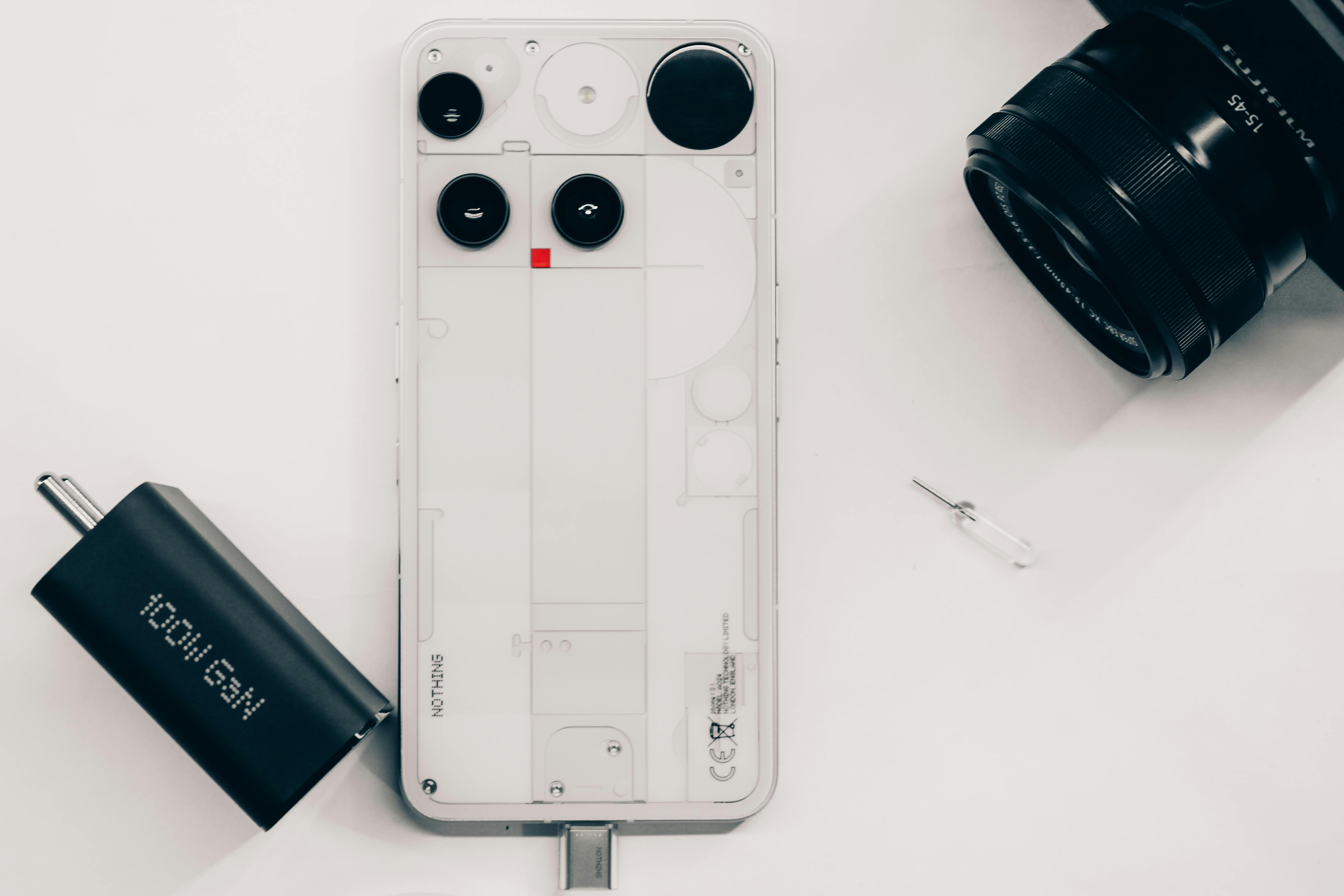 Modern smartphone and camera flat lay · Free Stock Photo