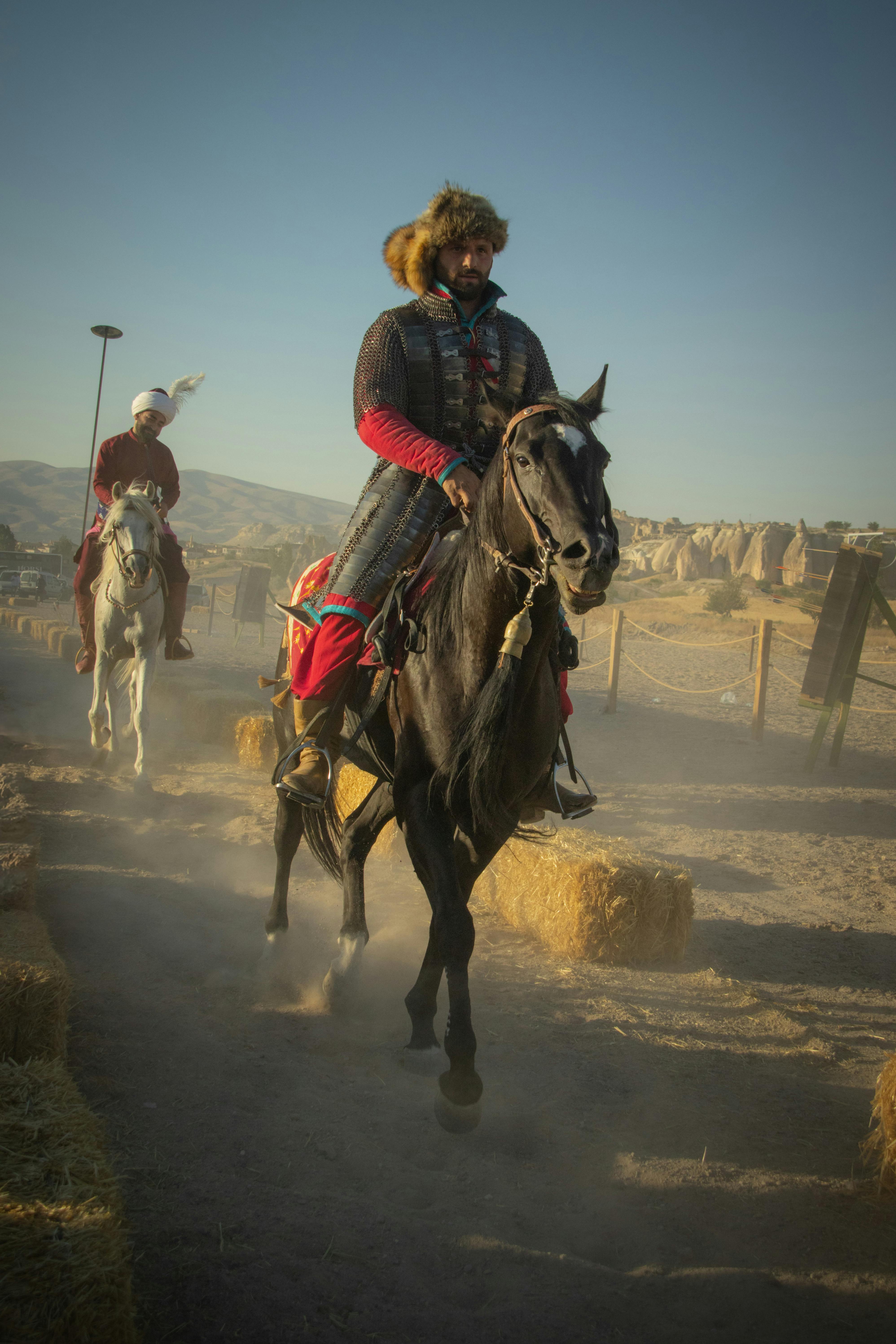 Medieval Horsemen in Authentic Armor Riding Outdoors · Free Stock Photo