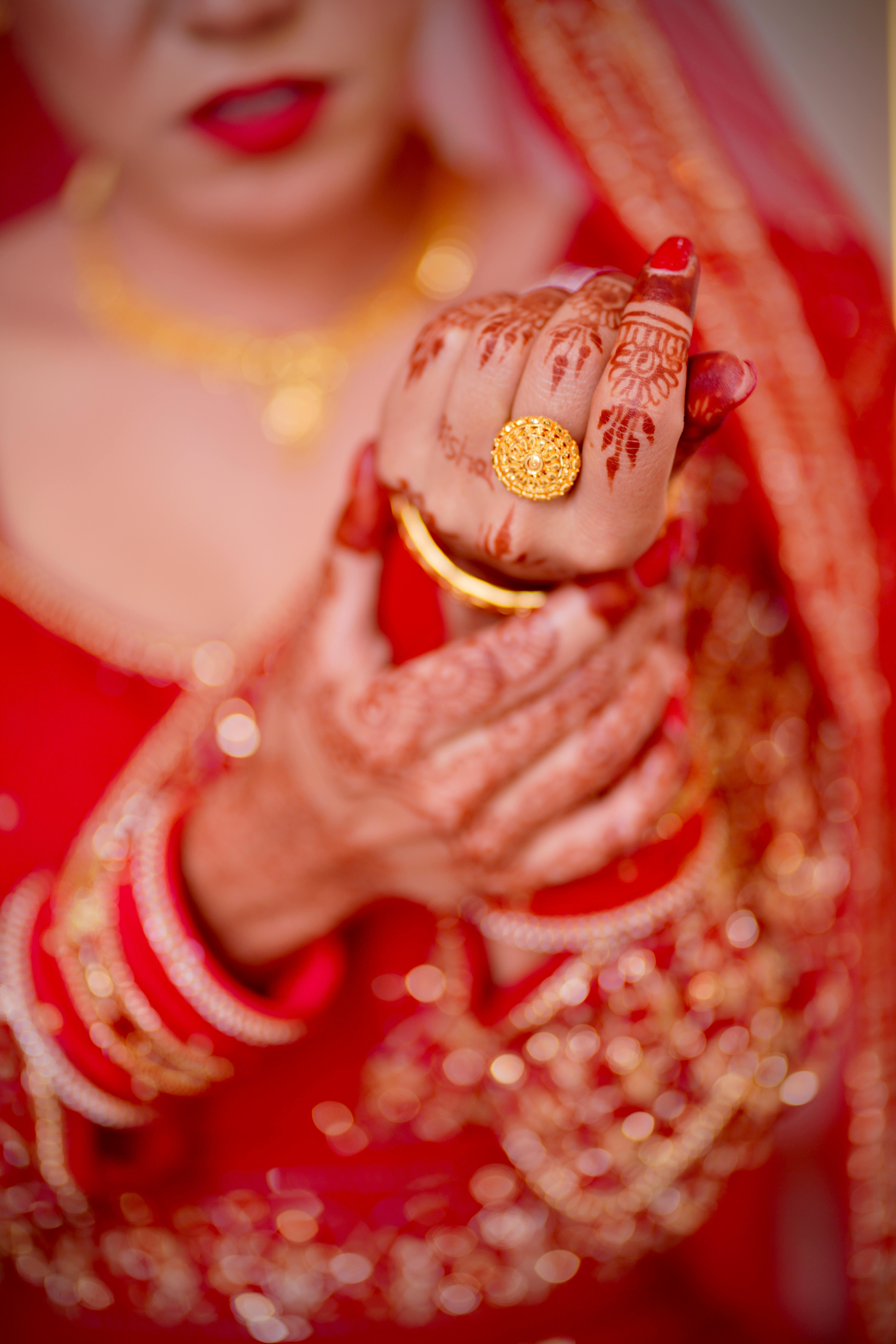 Vibrant Bride's Hand Showing Henna and Jewelry · Free Stock Photo
