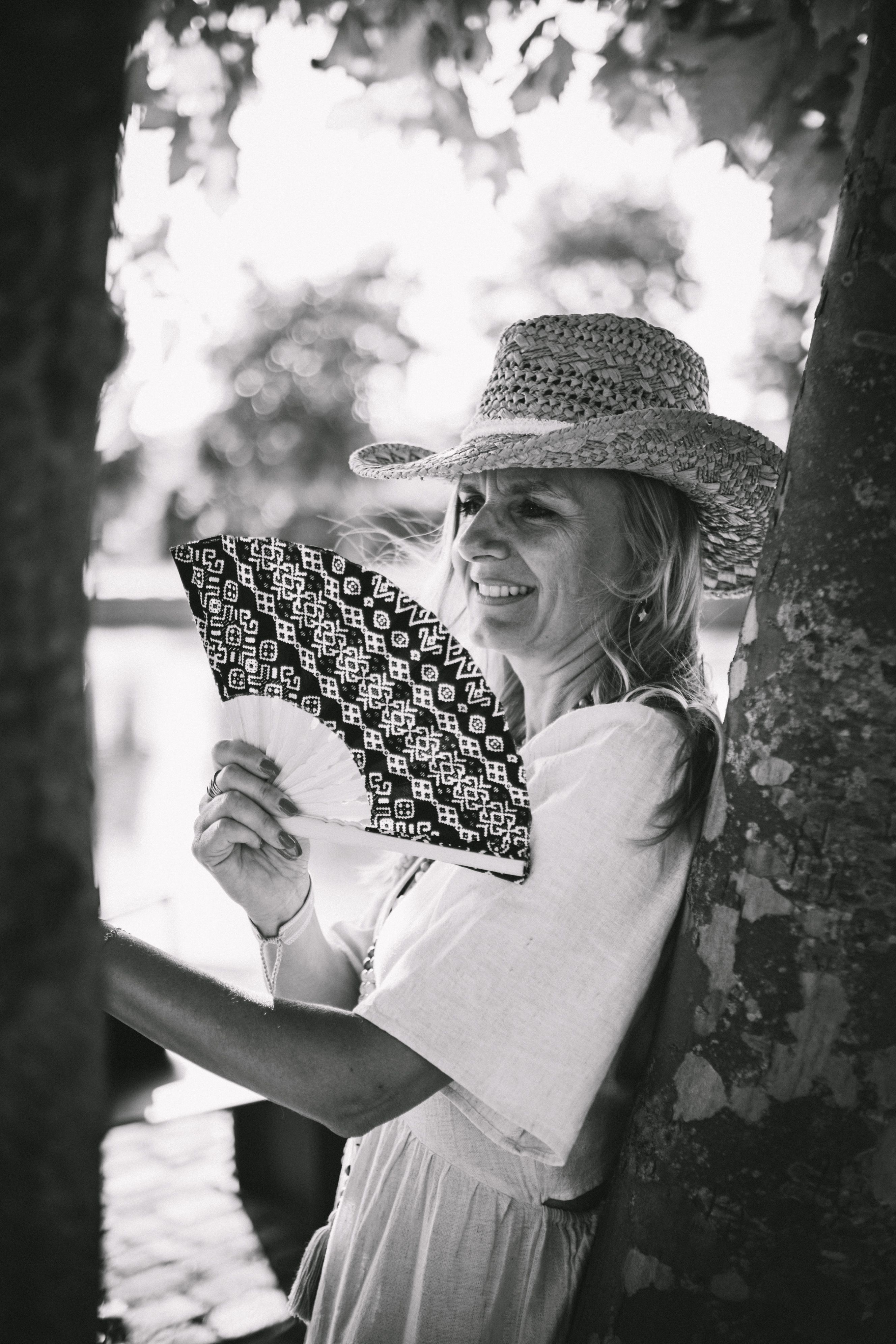 Black and White Portrait of Woman with Fan · Free Stock Photo
