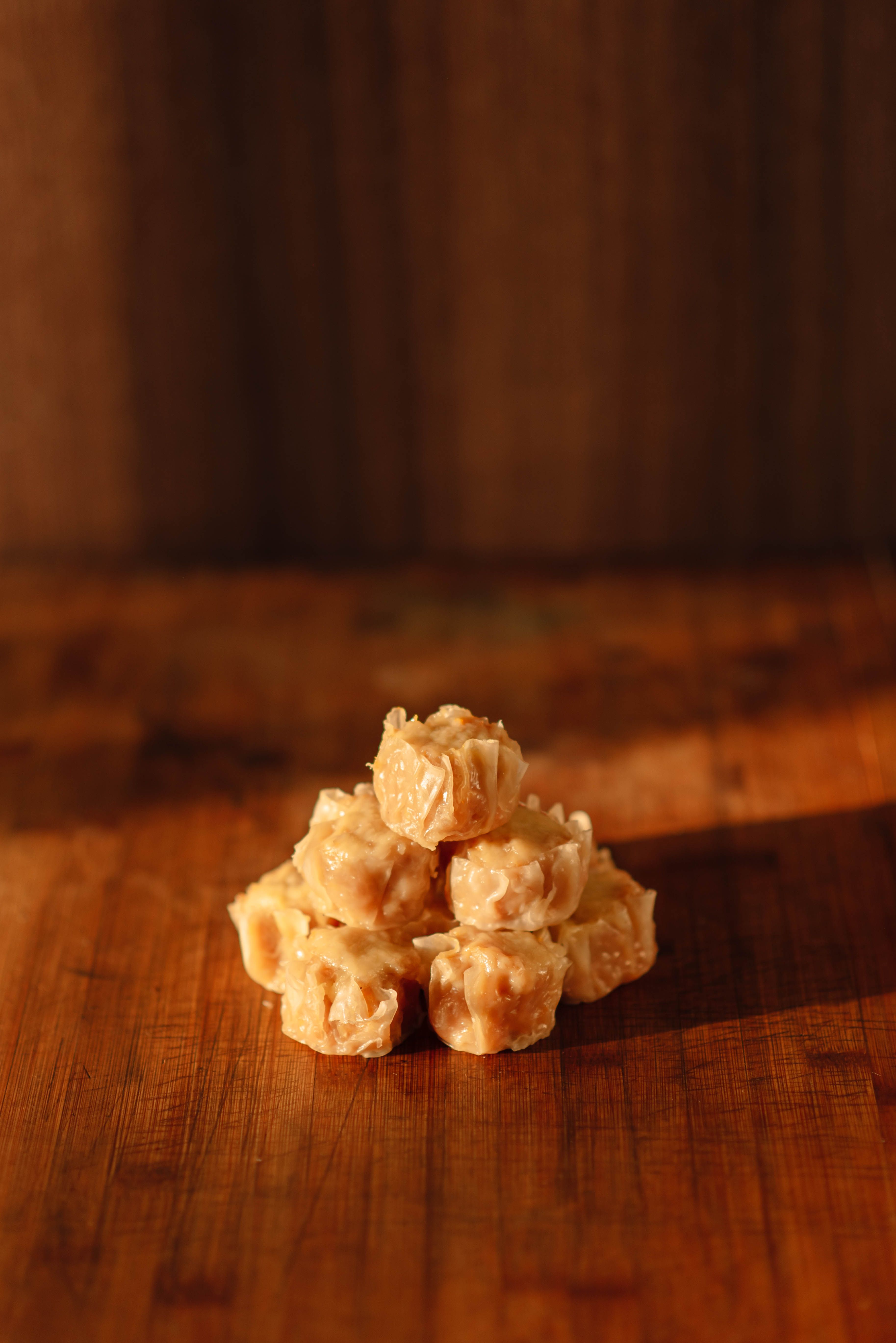 Traditional Chinese Dim Sum on Wooden Board · Free Stock Photo
