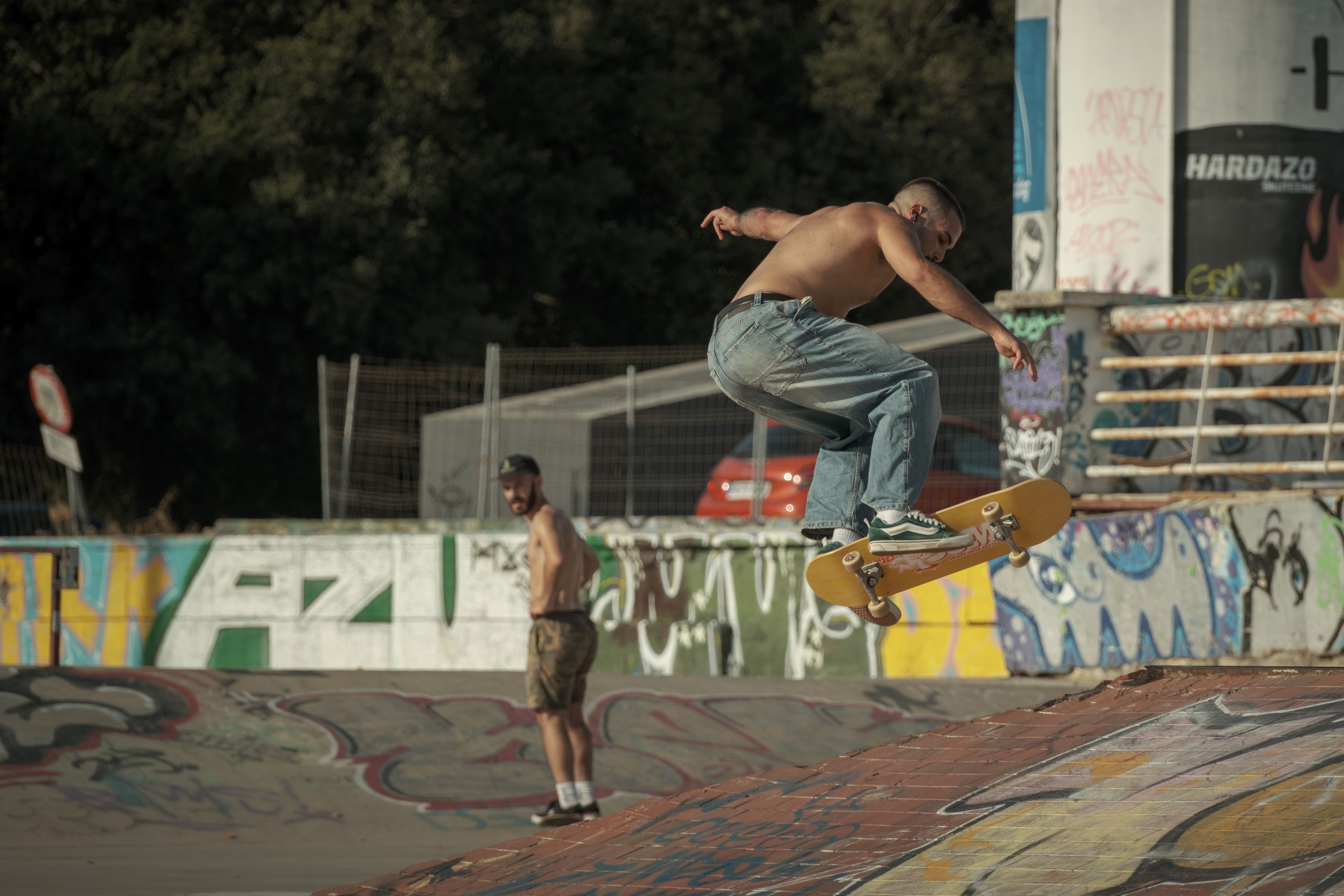 Skateboarder Performing Trick in Urban Skate Park · Free Stock Photo